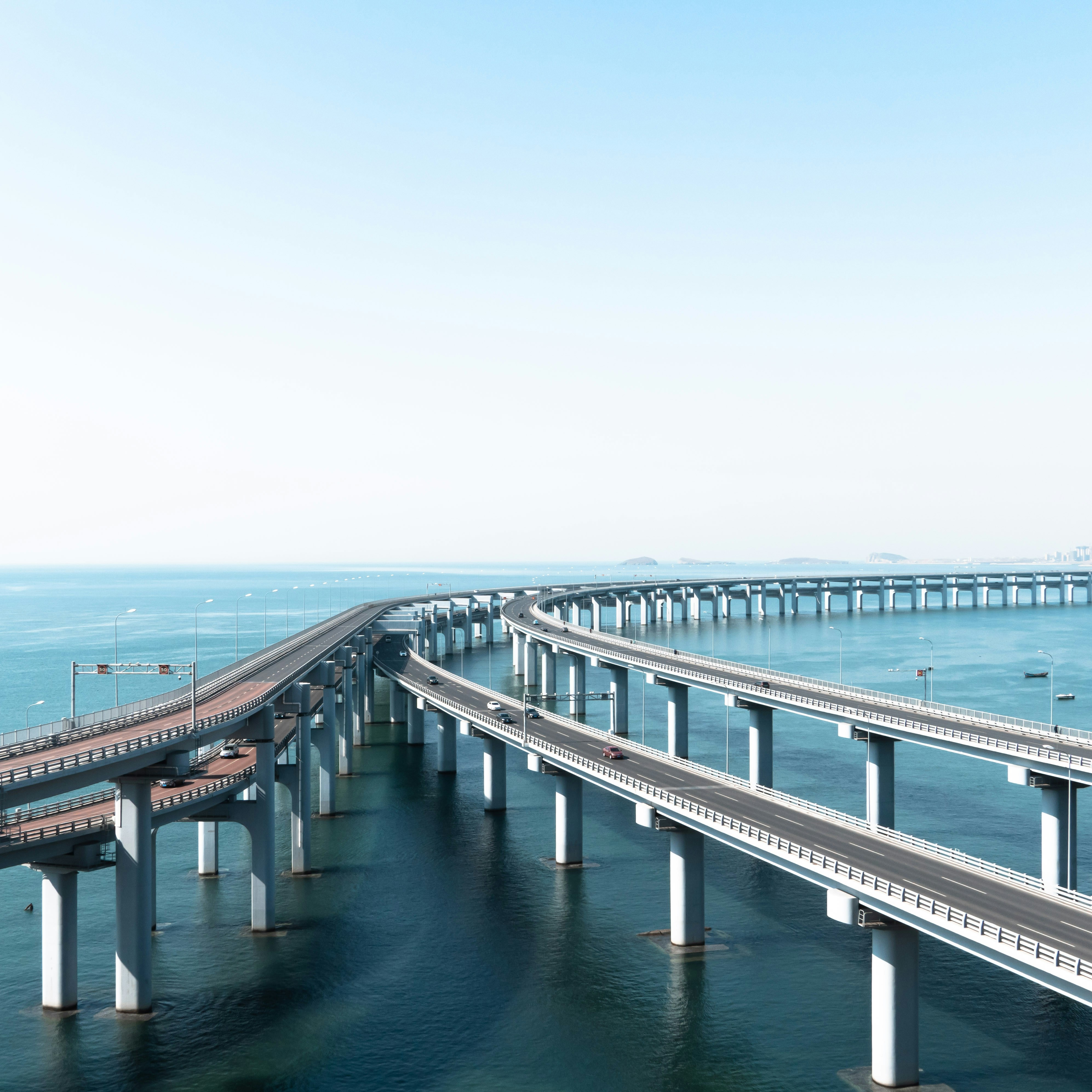 A large bridge over a large body of water photo – Free Liaoning Image ...