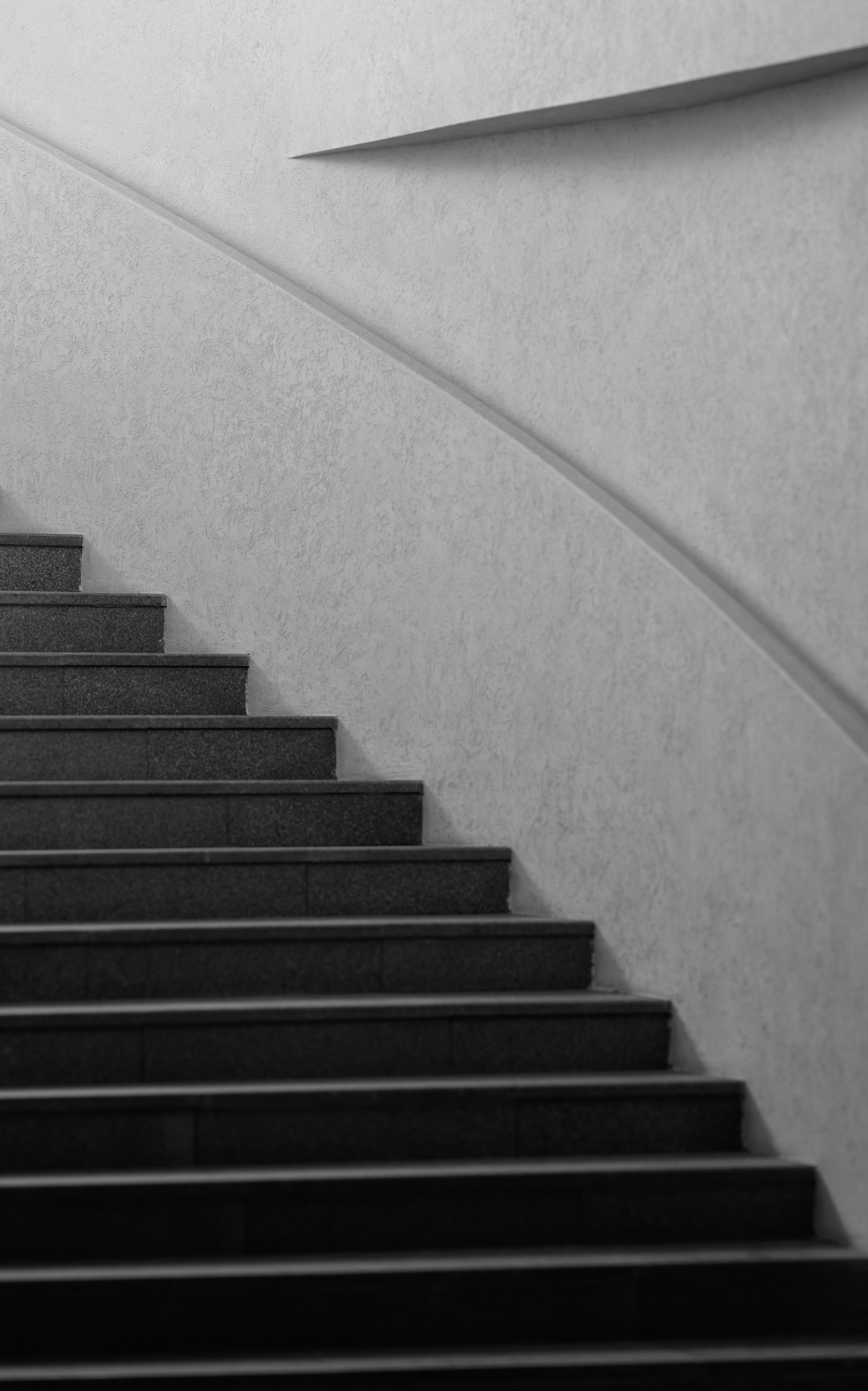 concrete stairs | a black and white photo of a stair case