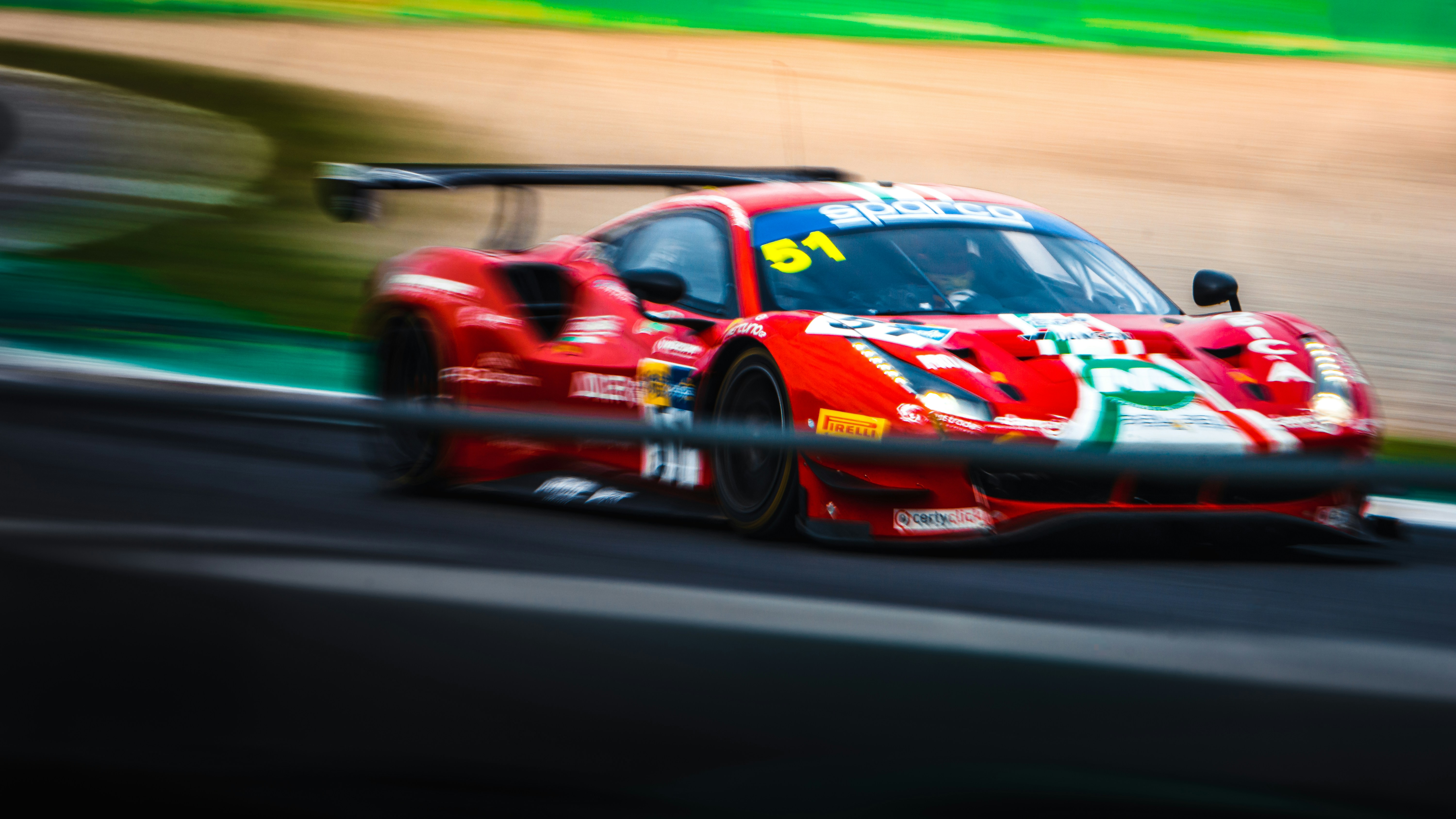 A red race car driving down a race track photo – Free Monza Image on ...
