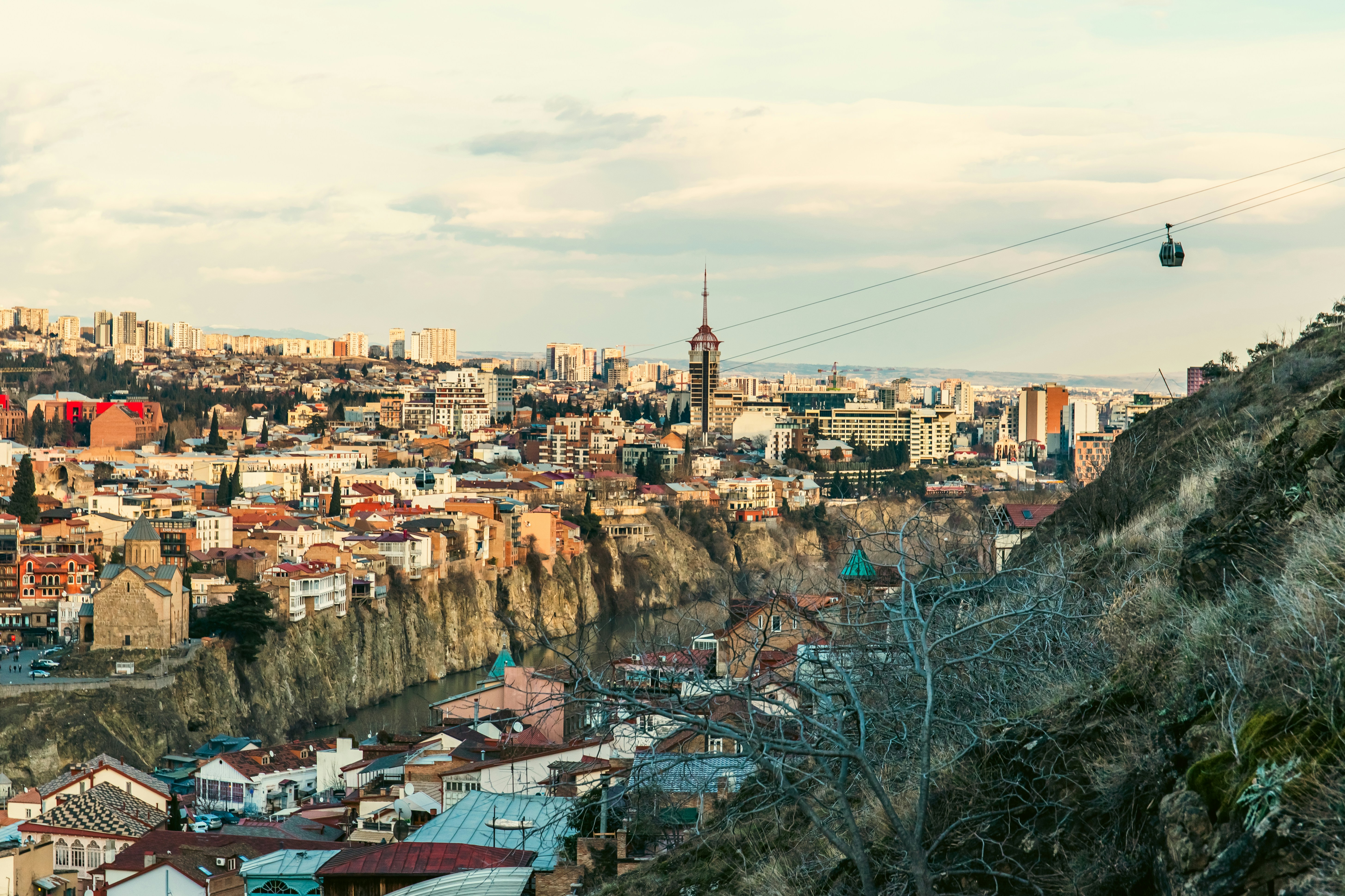 Cable Car Over the City: A Vista of Rooftops and Hills