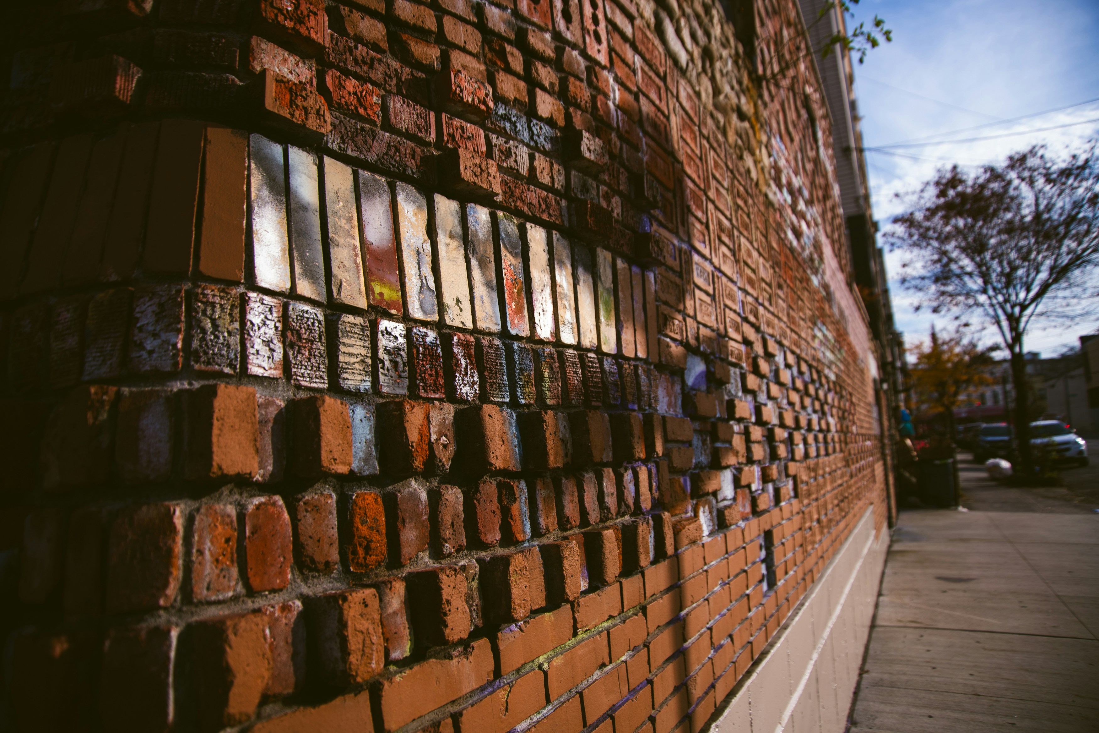 A brick wall with many different colored bricks on it photo – Free ...