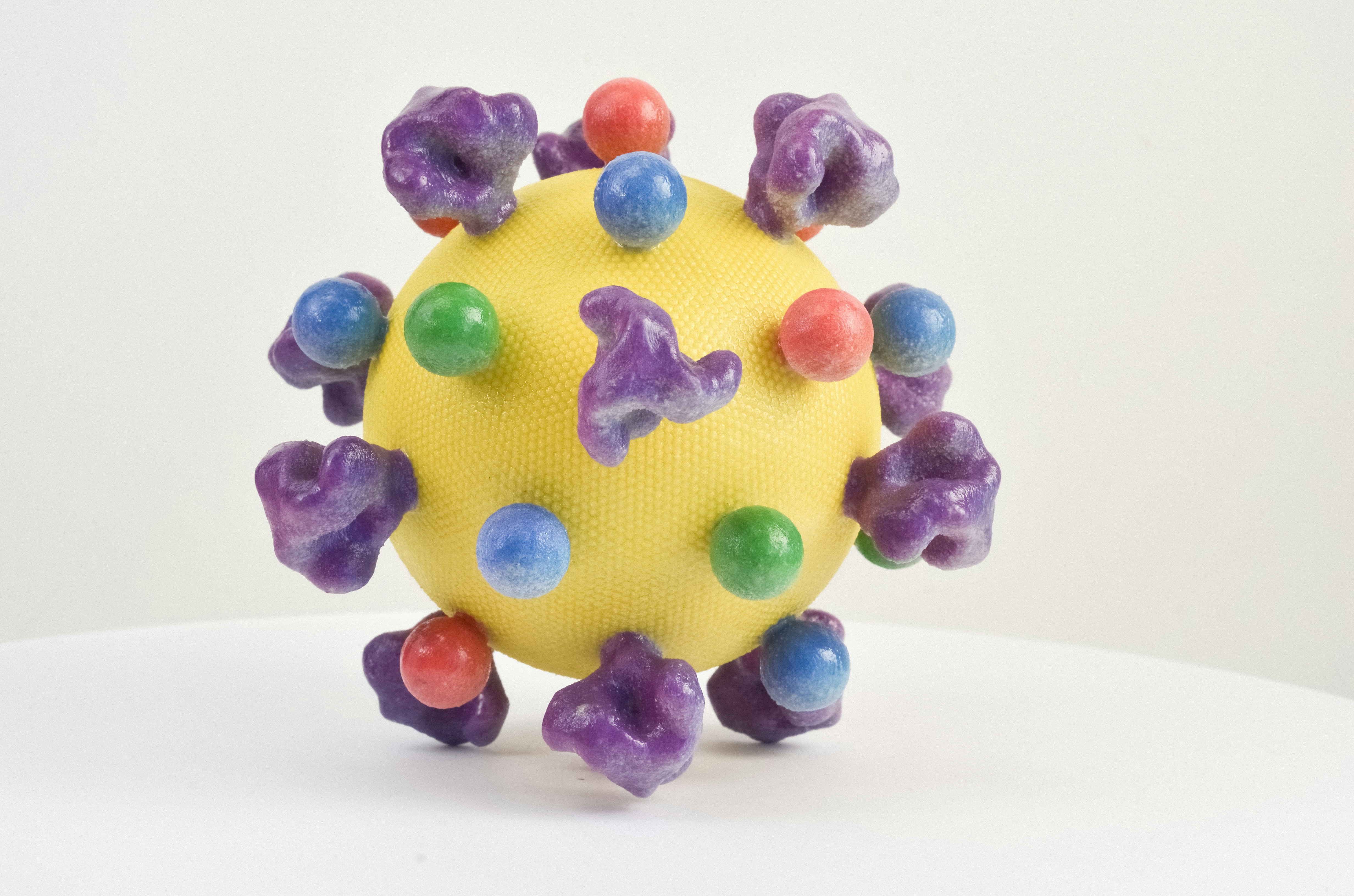 Colorful Spiked Toy Ball Under Soft Spotlight