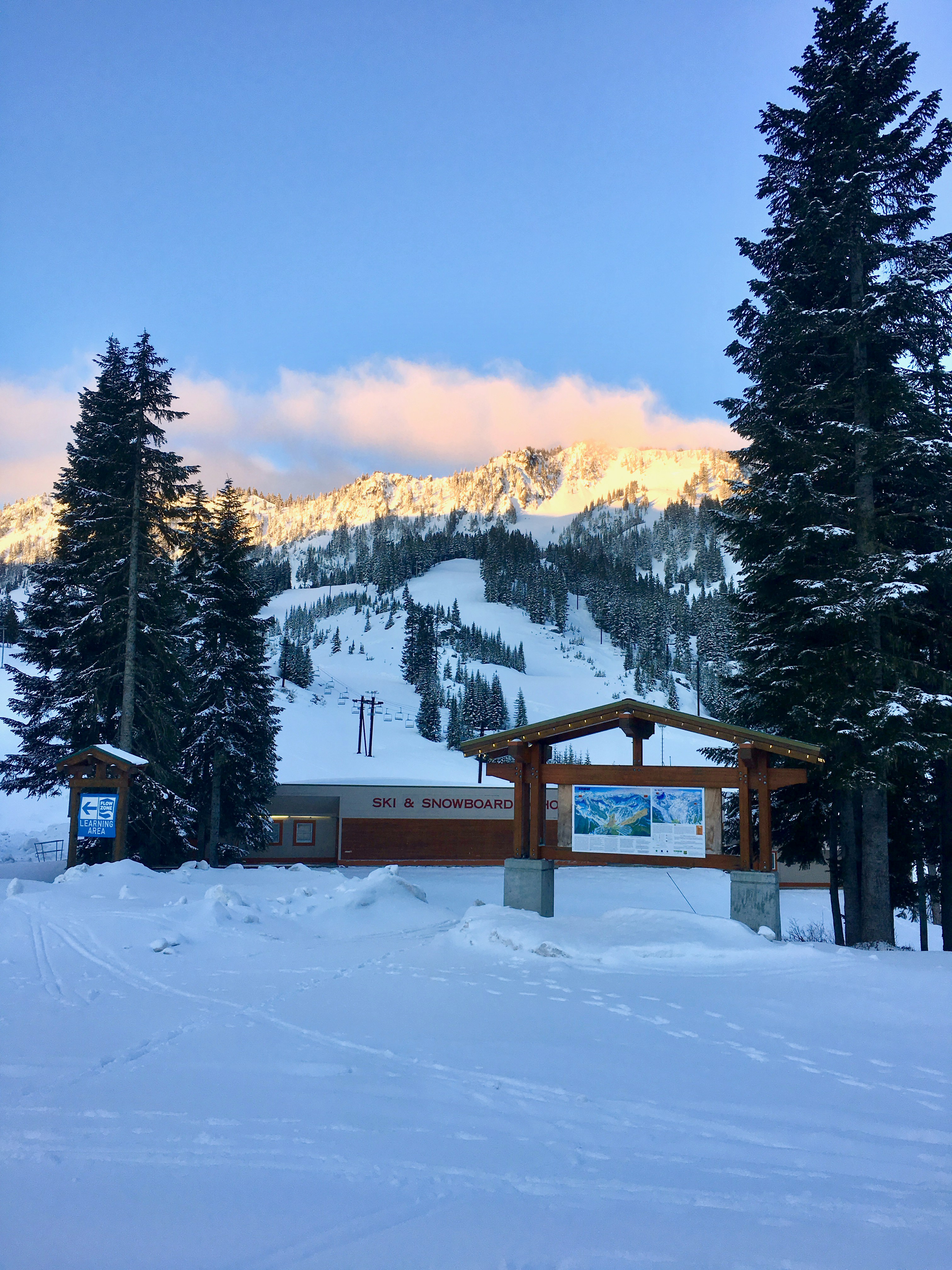 A ski resort with a mountain in the background photo – Free Stevens ...