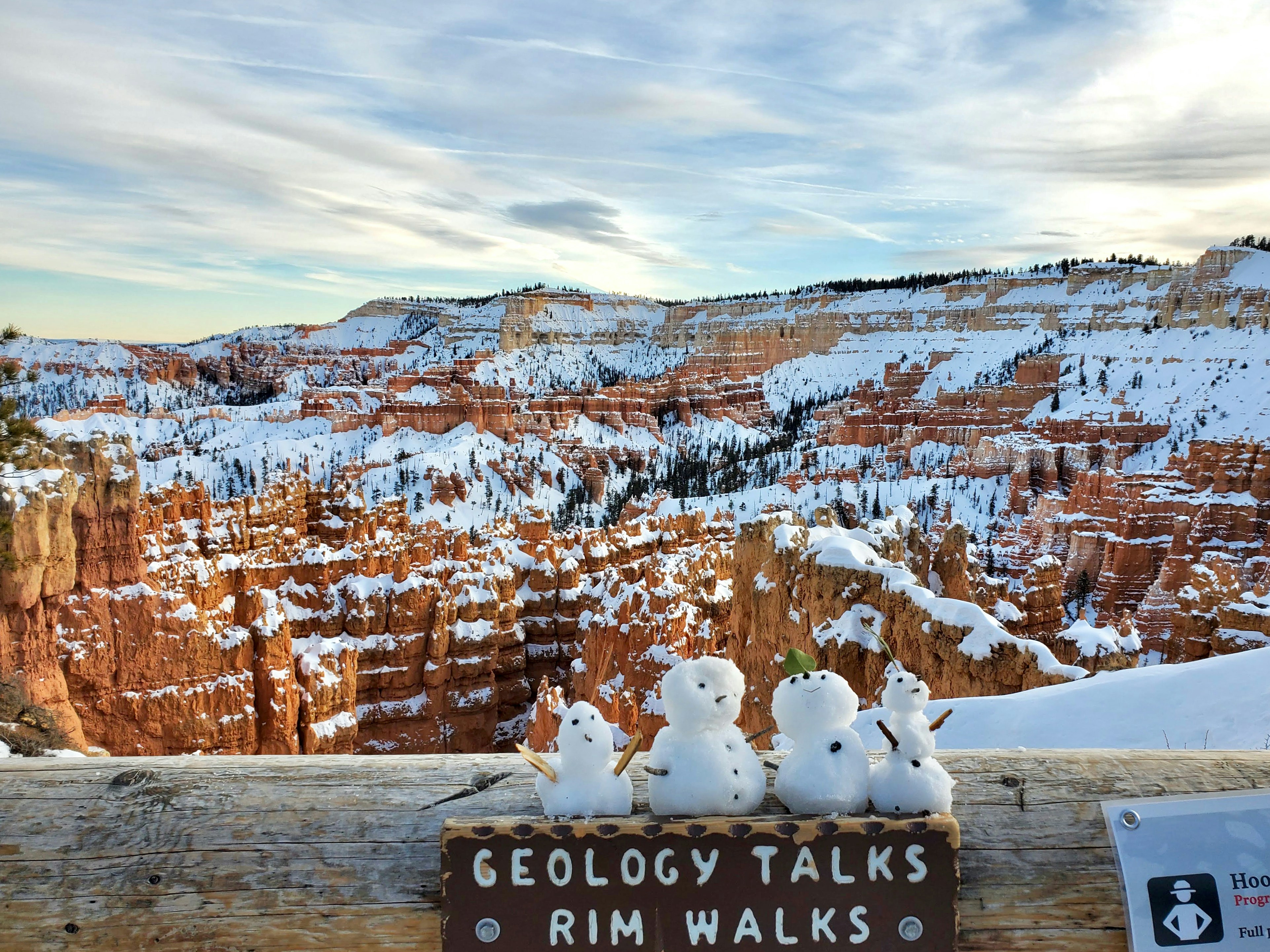 Winter Snow at Bryce Canyon National Park, nestled in southern Utah, stands as a geological masterpiece shaped by the forces of erosion over millions of years. What makes Bryce Canyon truly unique are its hoodoos, tall, thin spires of rock protruding from the ground, creating an otherworldly landscape of intricate shapes and vibrant colors. These hoodoos, sculpted by the combined effects of frost-wedging and erosion from water and wind, create a mesmerizing sight that changes with the light of day, casting surreal shadows and highlighting the park's natural beauty.