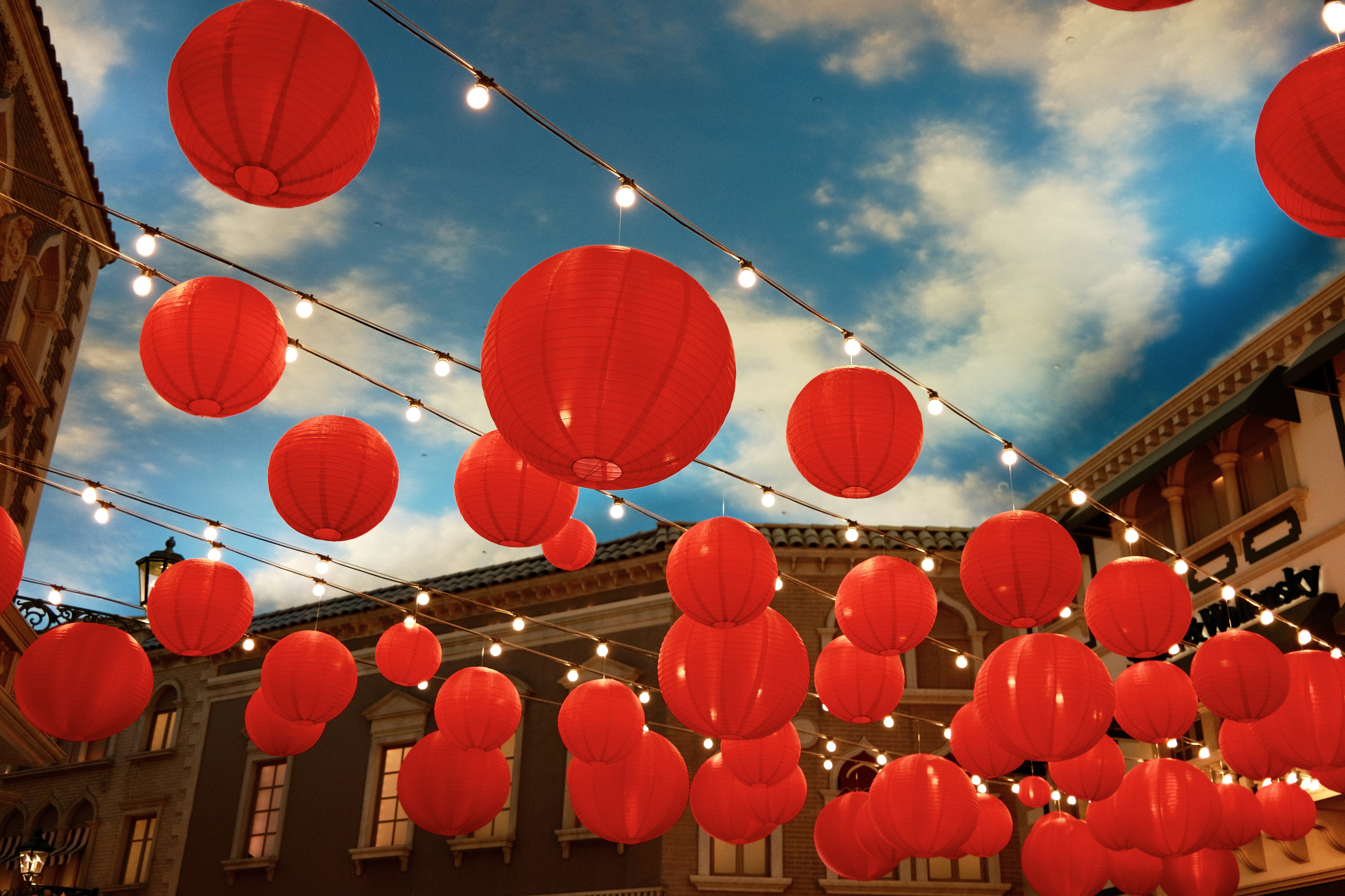 Crimson Orbs Above the Quiet Street