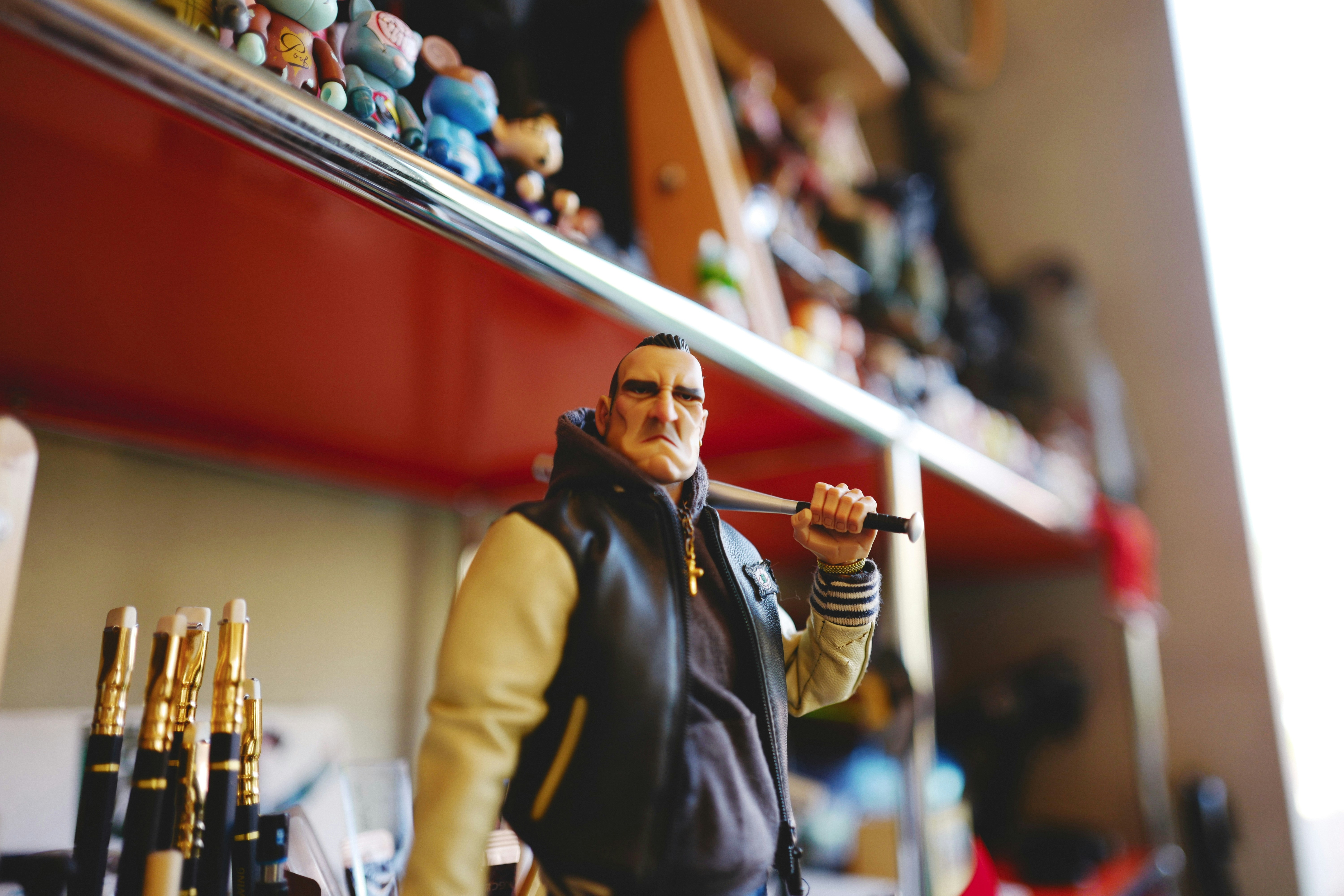 A toy man holding a microphone in his hand photo – Free Figure Image on ...