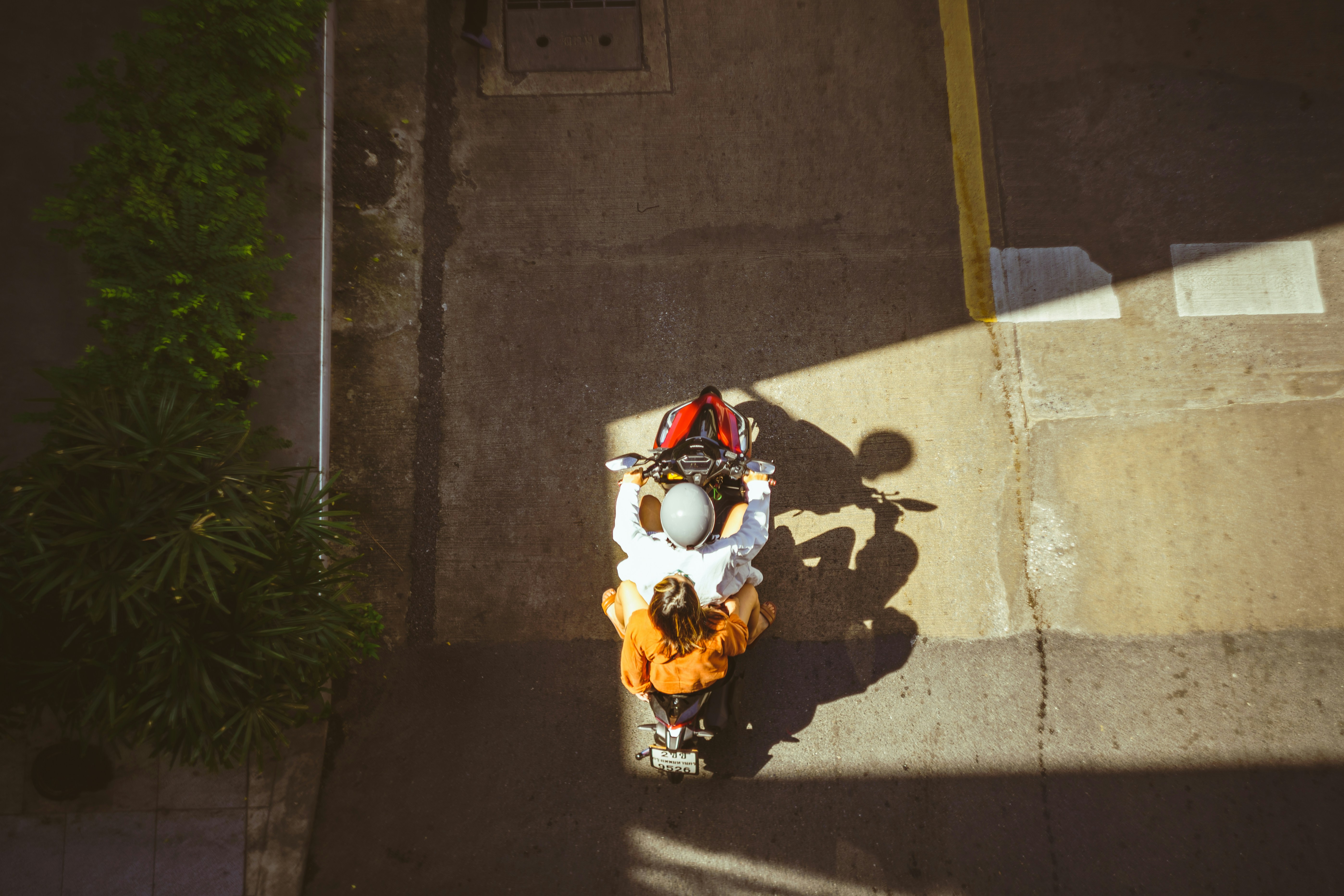 a person riding a motorcycle down a street
