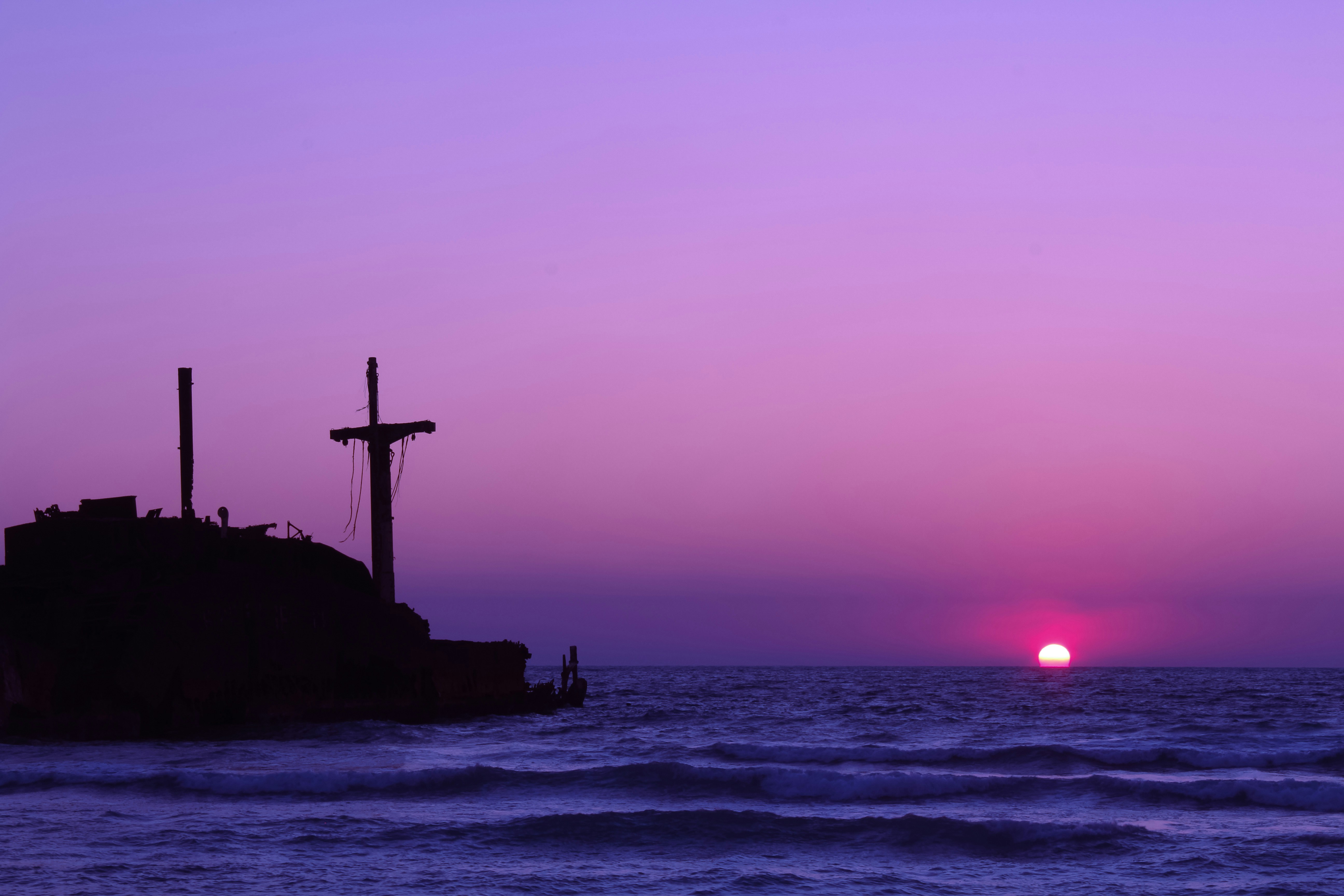 Dusk Cross on the Quiet Horizon: A Purple Ocean Sunset