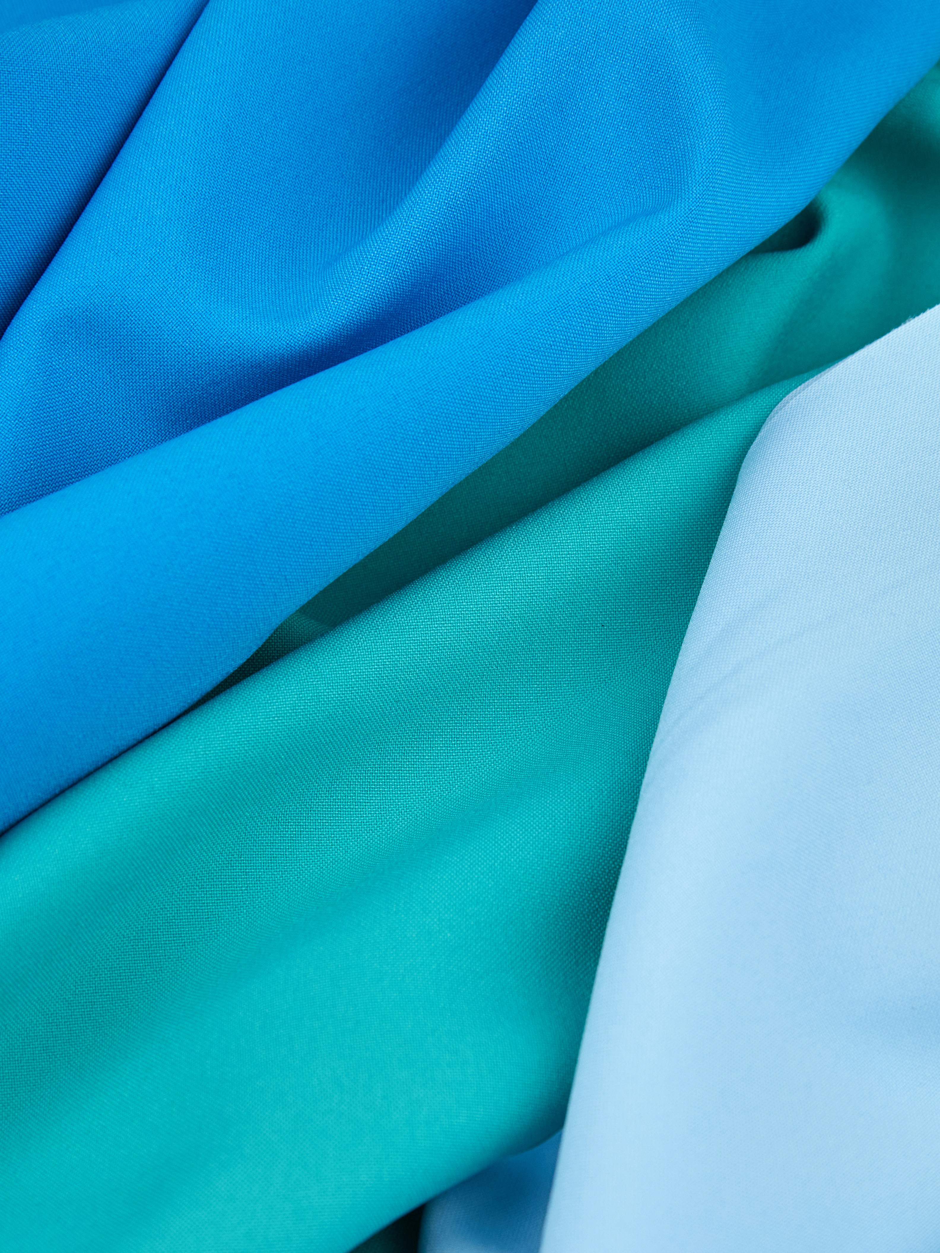 A close up of a blue and green fabric photo – Free Blue Image on Unsplash
