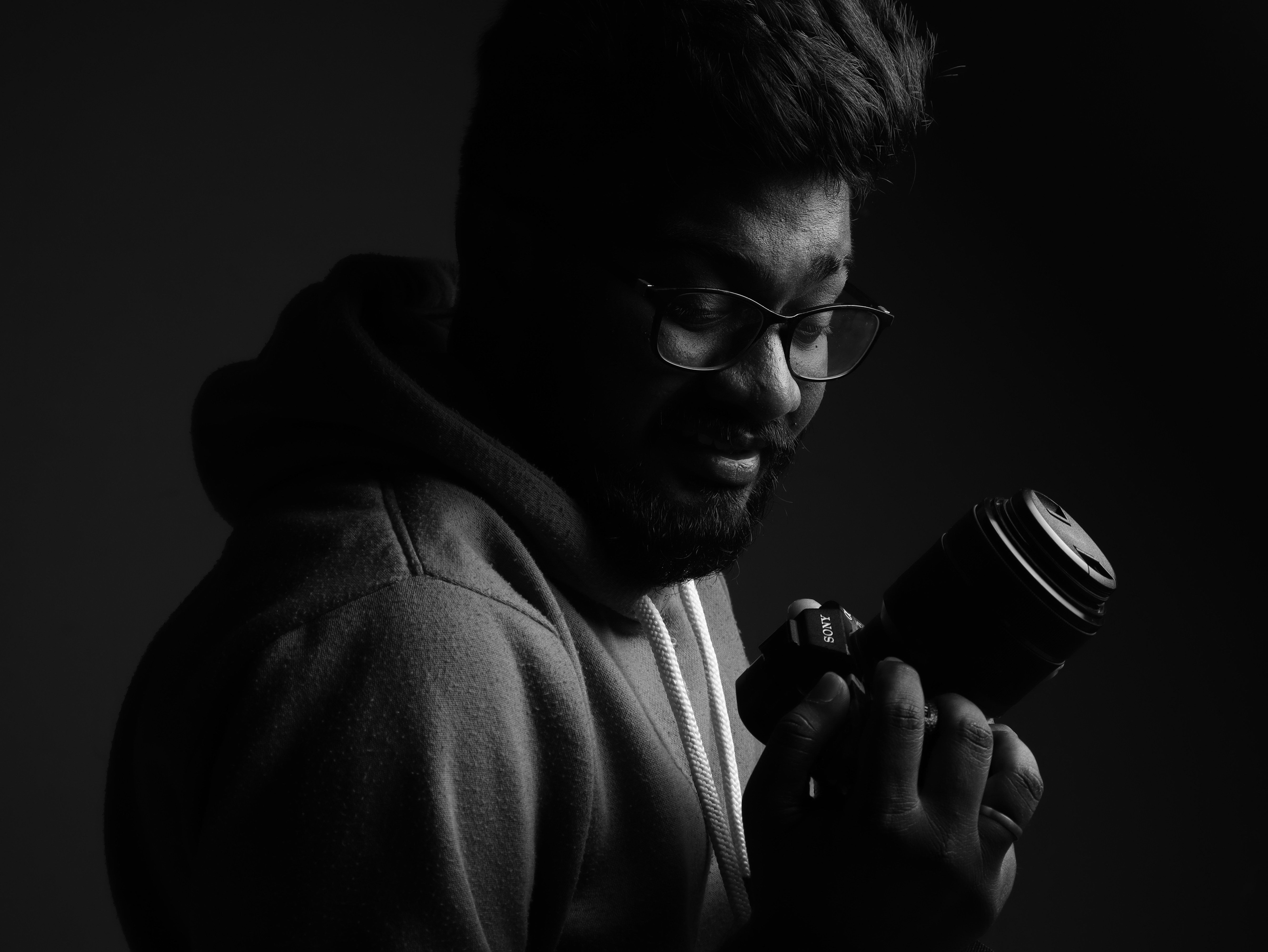Midnight Focus: Portrait of a Photographer in Quiet Thought