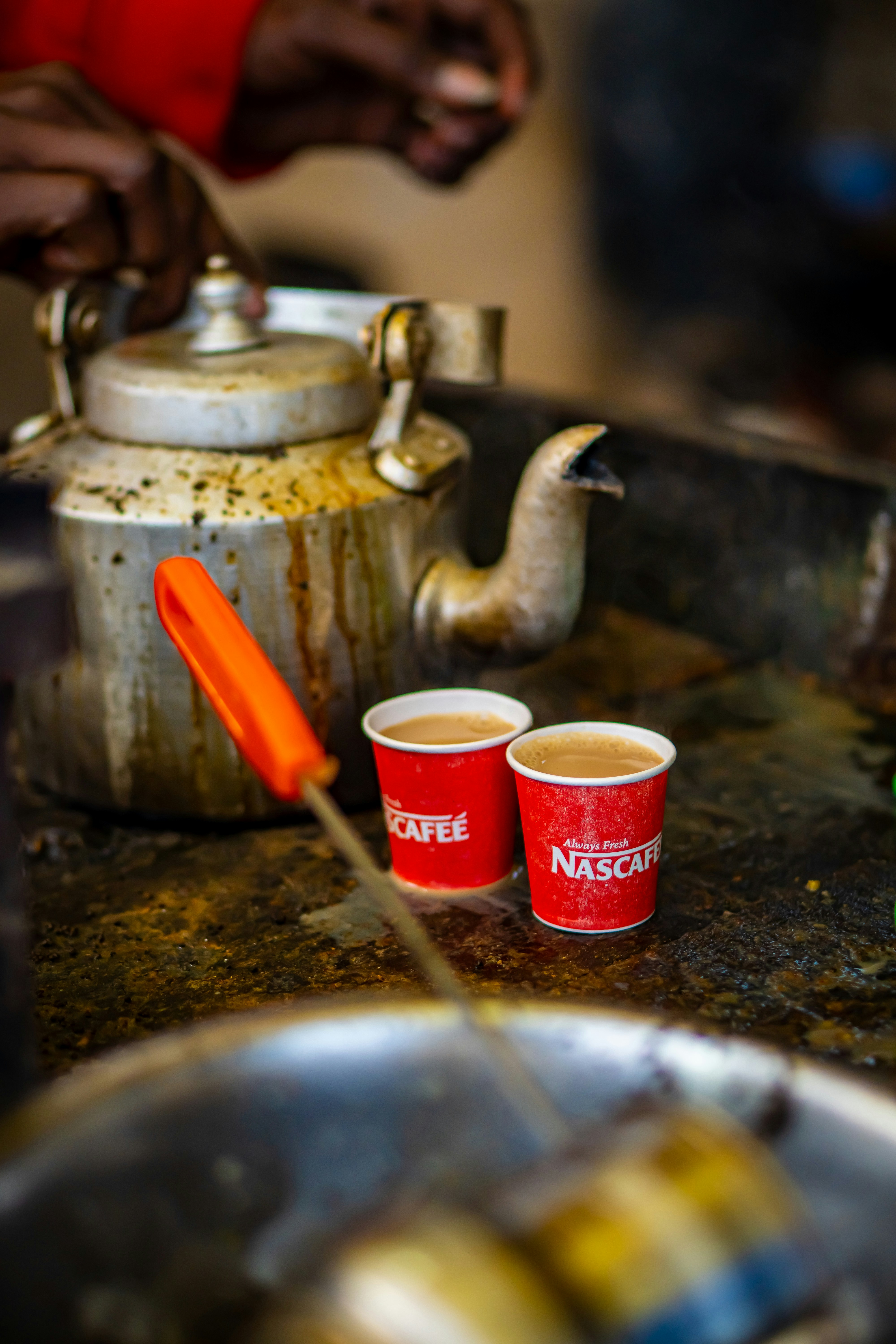Two cups of coffee are sitting on a stove photo – Free Drink Image on ...