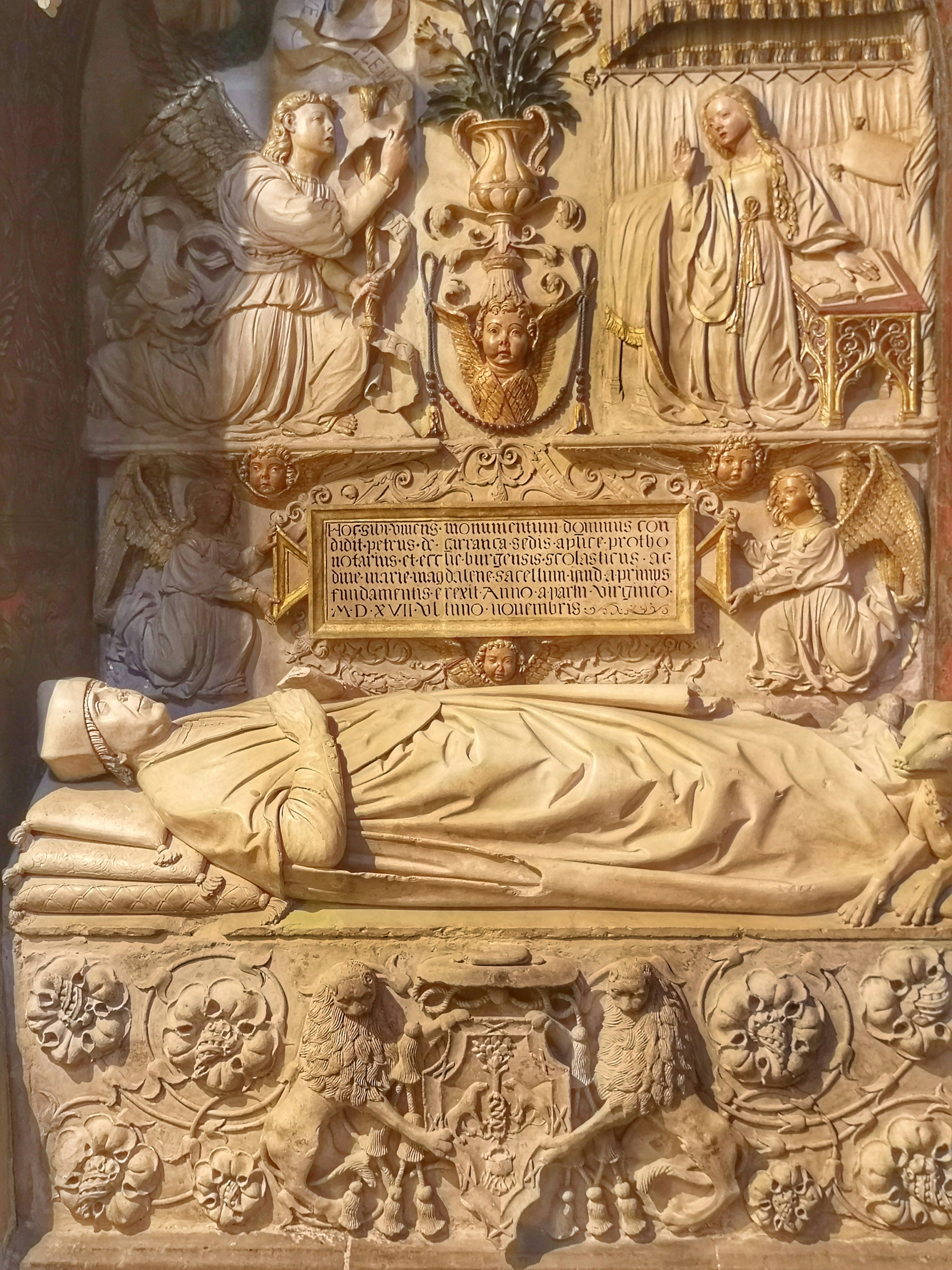 A statue of a man laying on top of a bed photo – Free Woman Image on ...