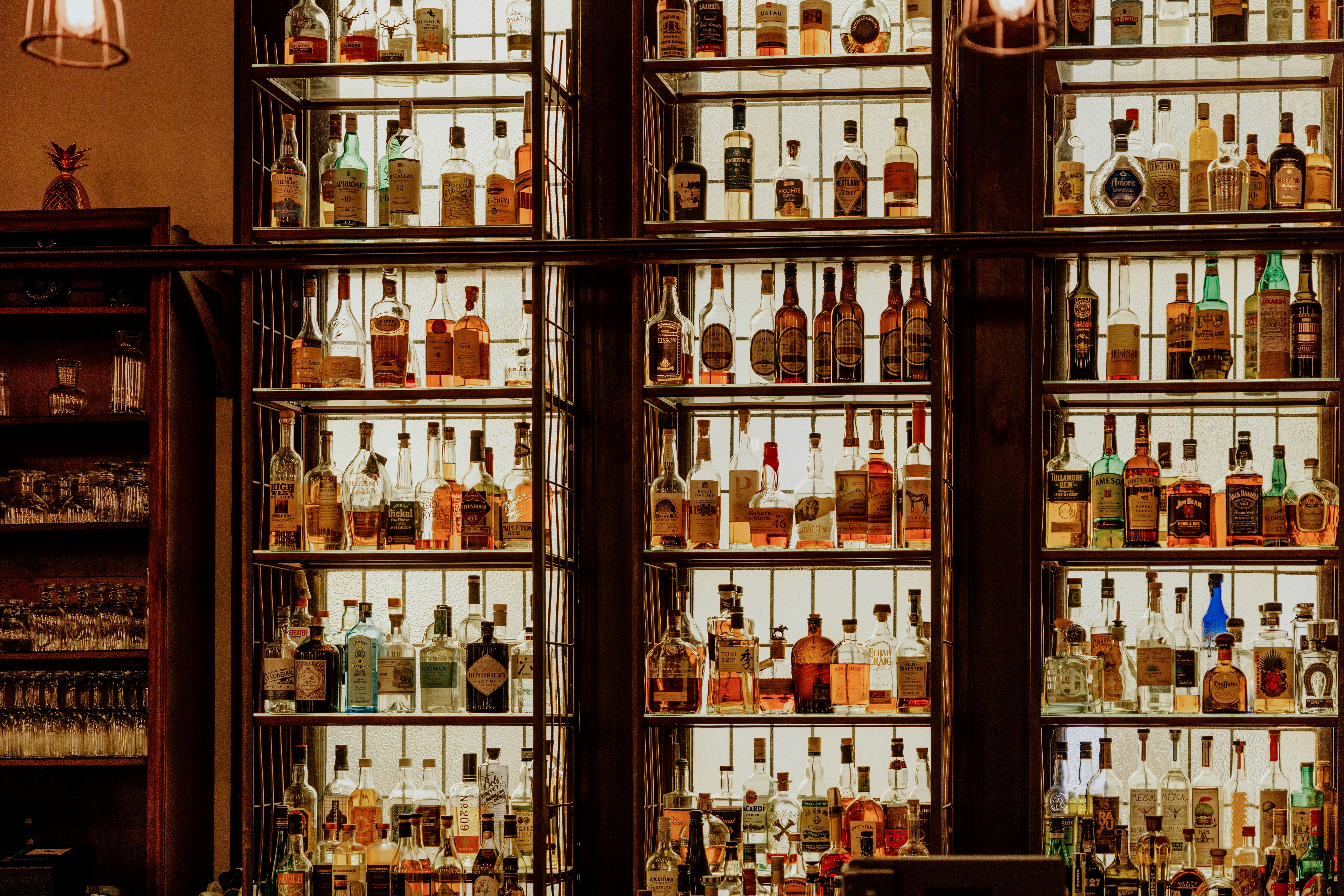 A wall of liquor bottles in a bar photo – Free Bar Image on Unsplash