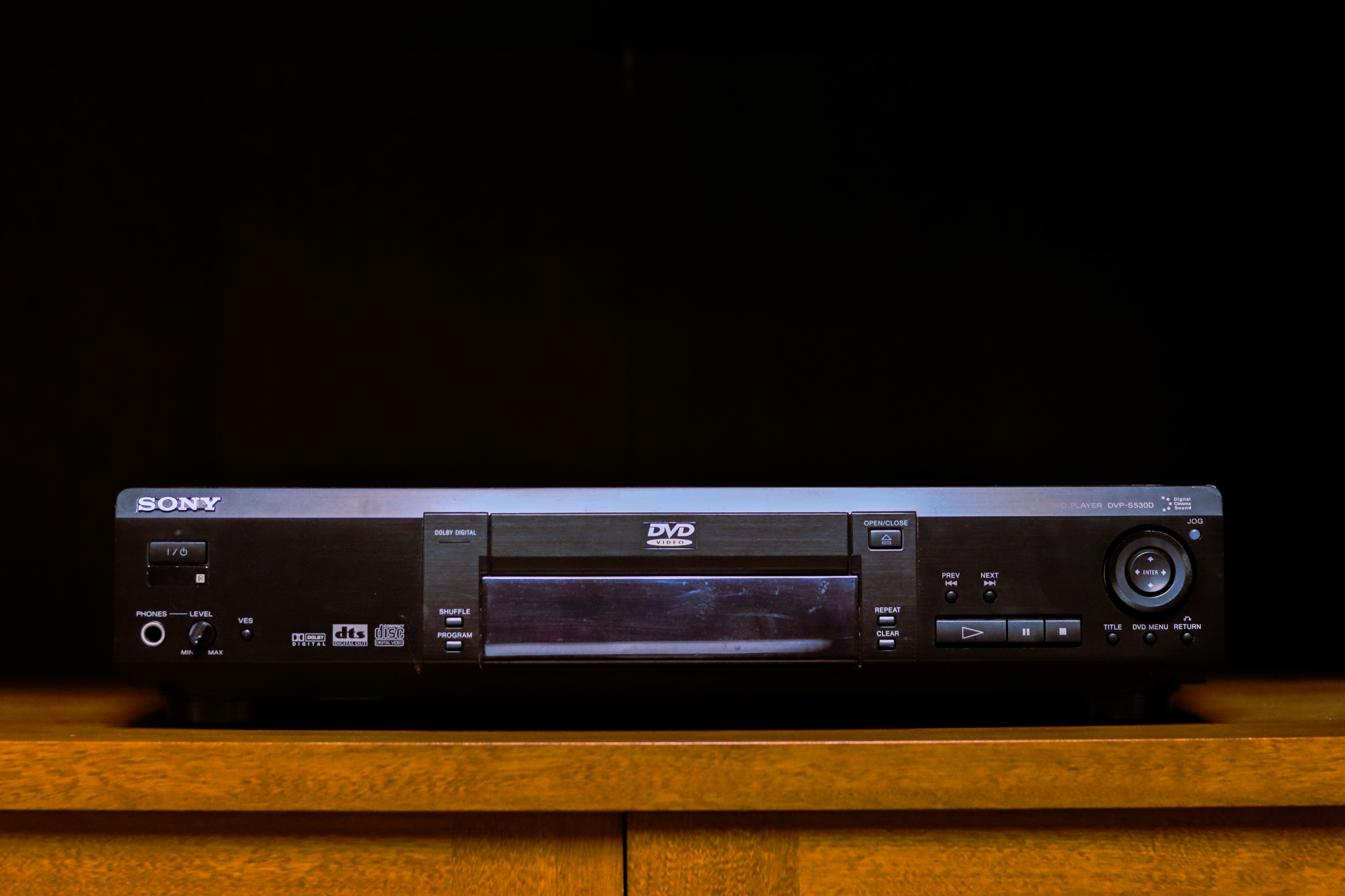 A sony dvd player sitting on top of a wooden table photo – Free Grey ...