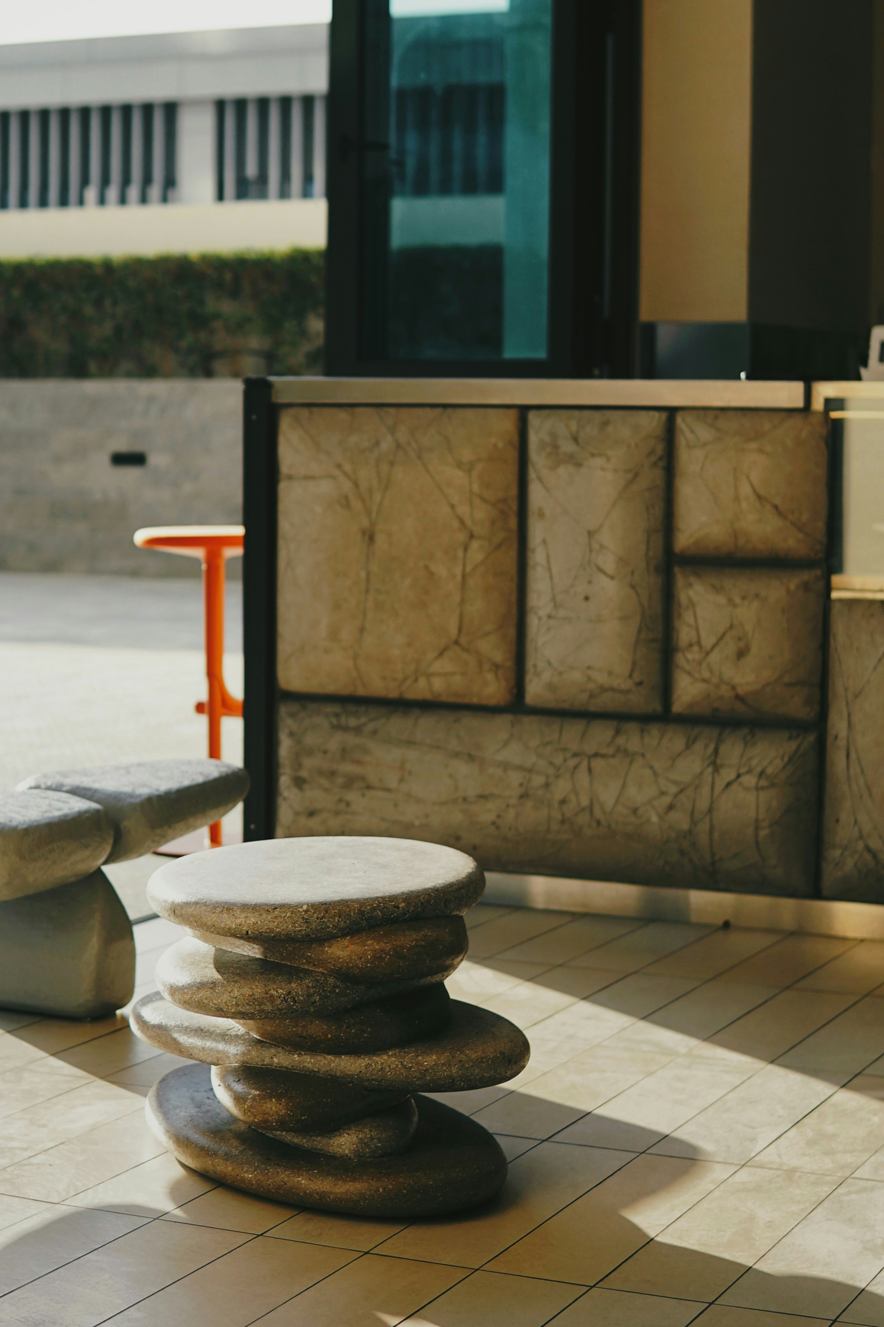 Stone Stack in a Quiet Atrium Bathed in Afternoon Light