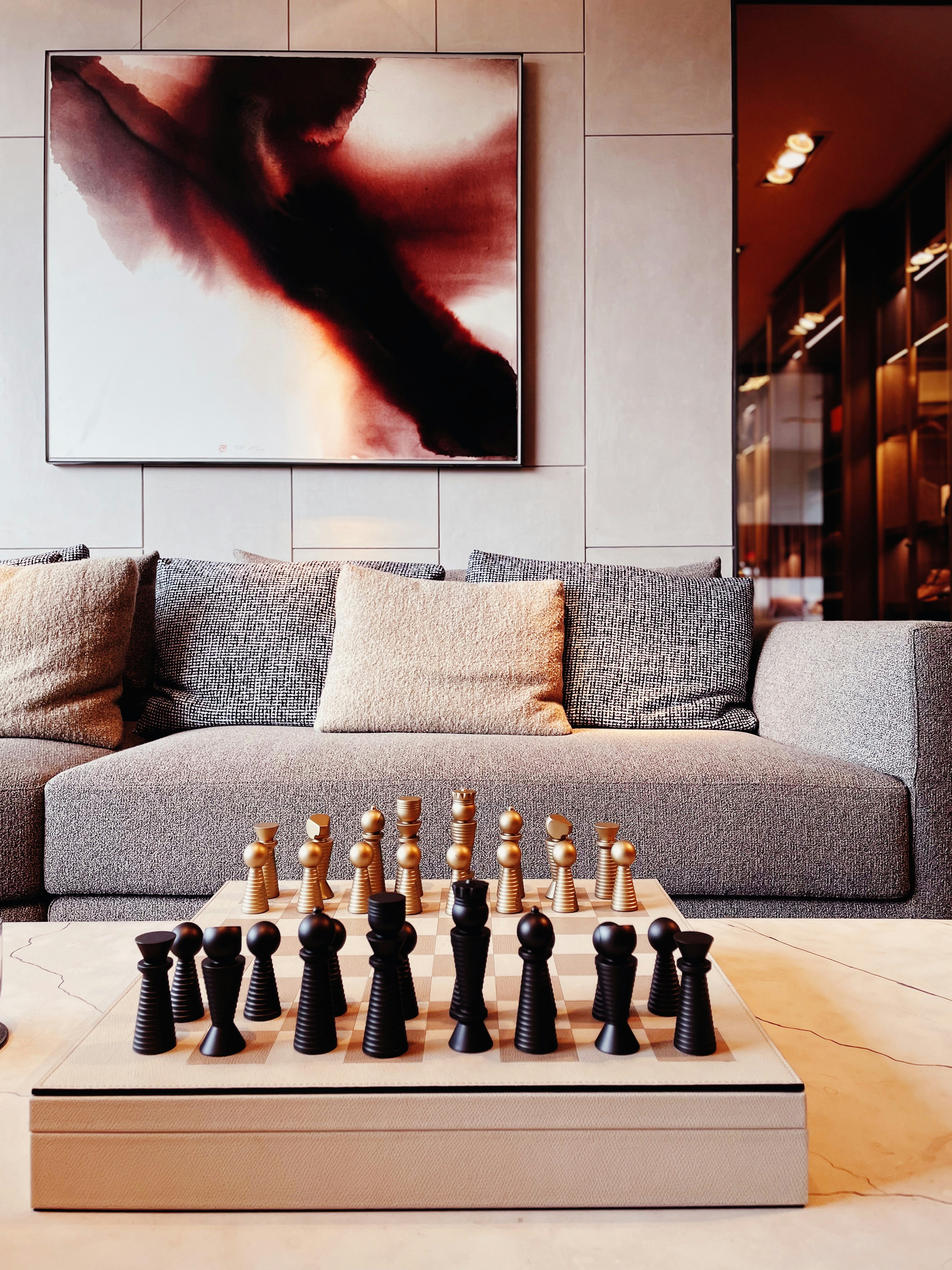 A living room with a couch and chess set photo – Free Indonesia Image ...