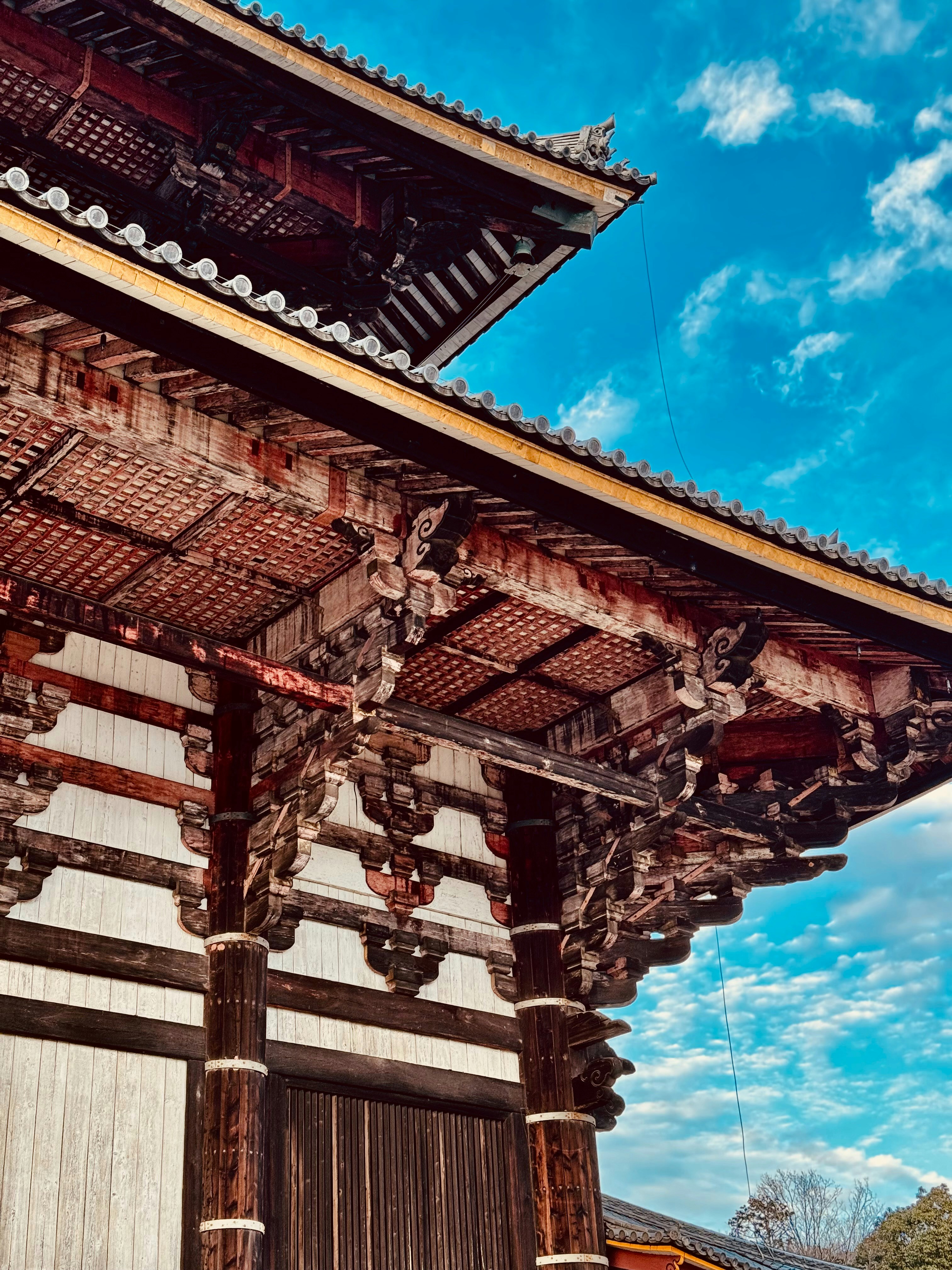 Corner of a Historic Roof: Timber Details Against a Cerulean Sky