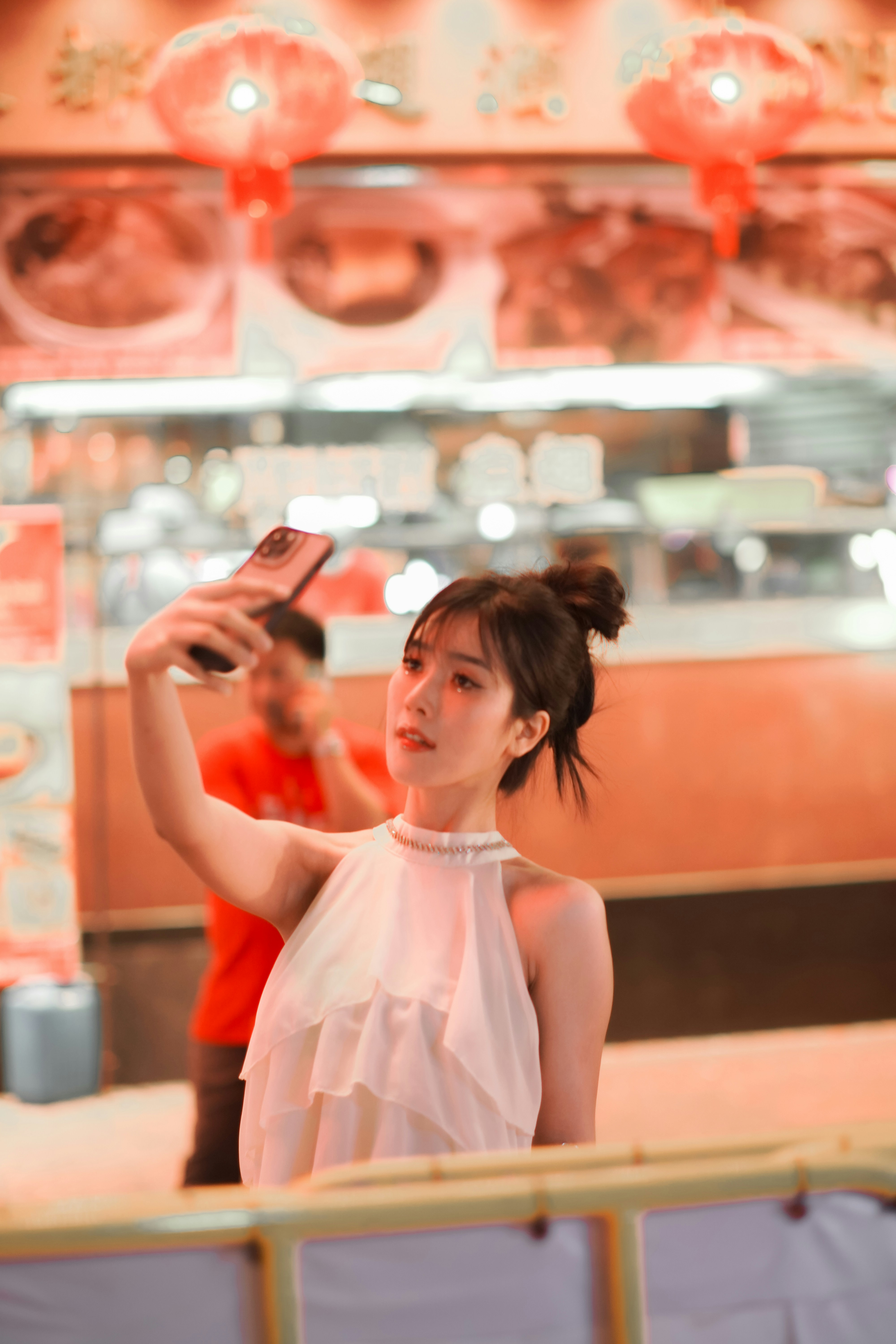 Selfie Under Crimson Lanterns at a Festive Night Market