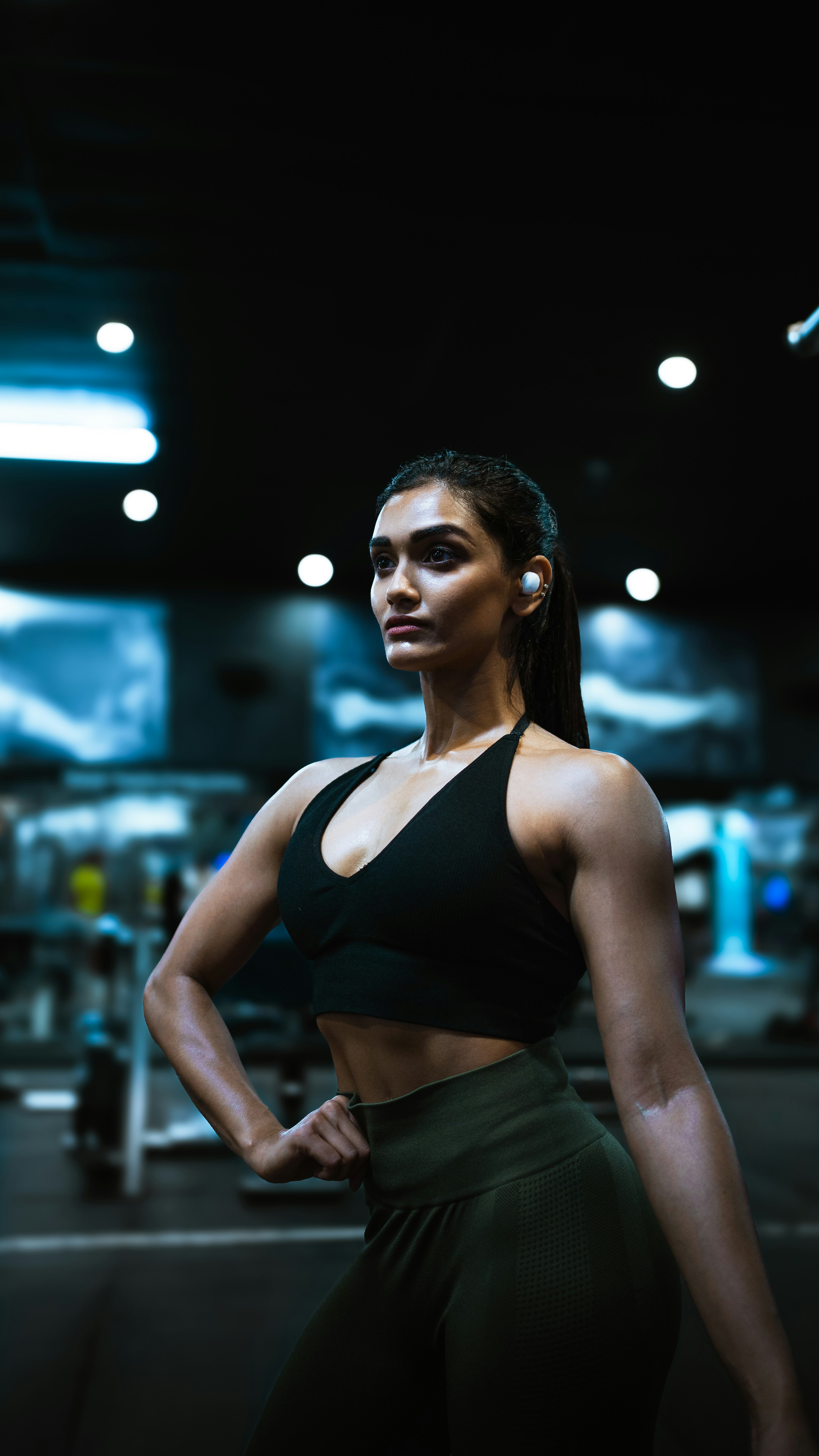 Blue-Glow Resolve: A Gym Portrait of Focus
