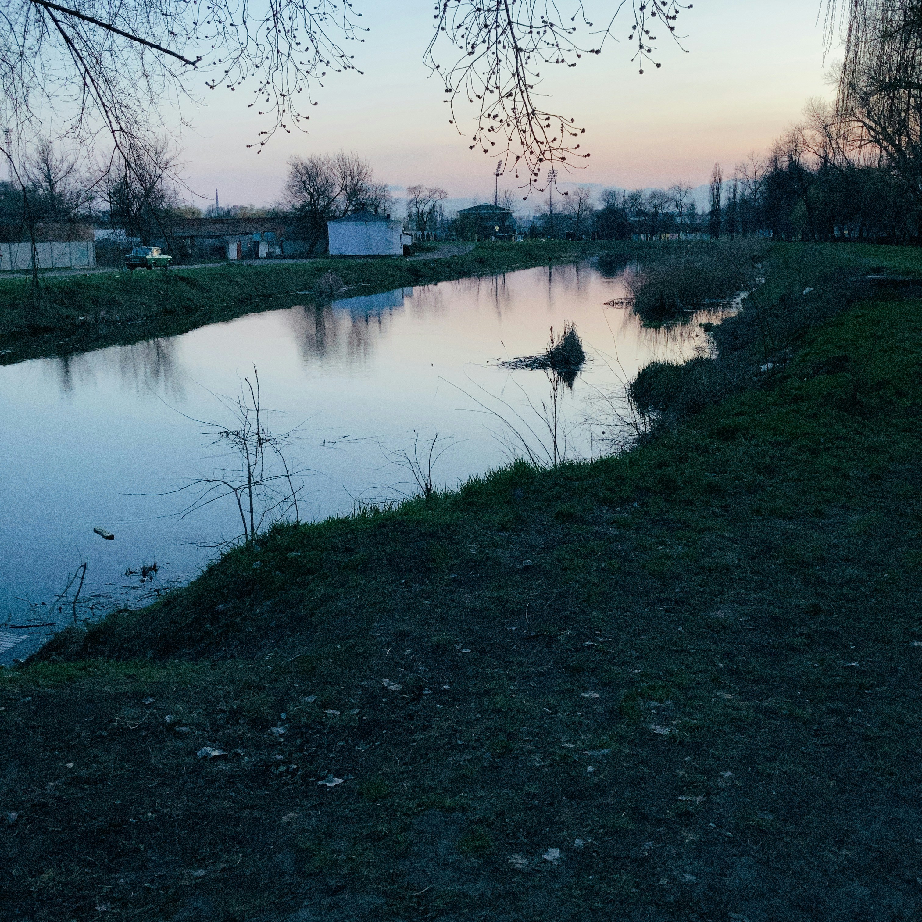 Twilight Canal Reflections Over Quiet Banks