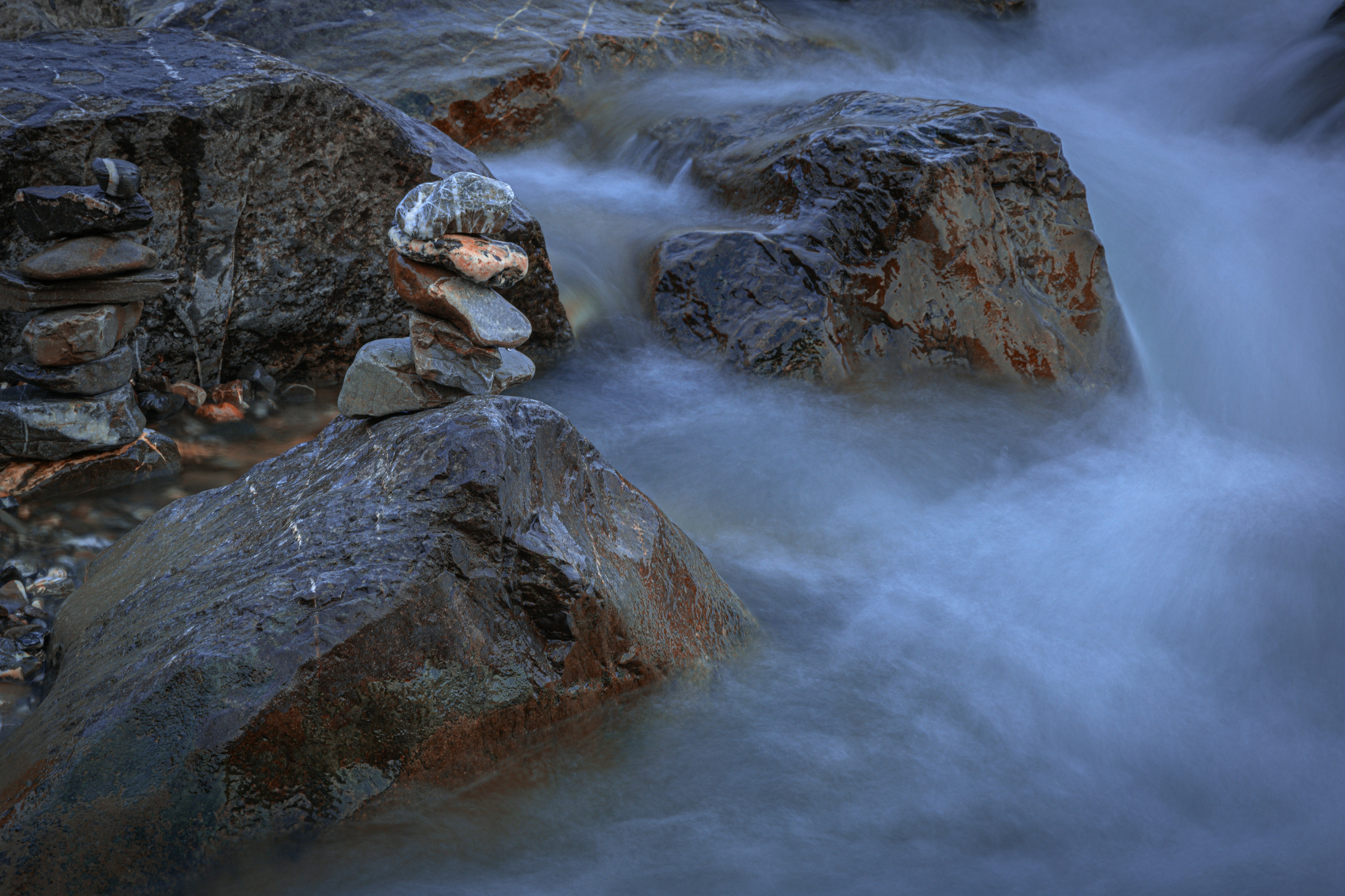 A stream of water running over rocks in a river photo – Free Grey Image ...