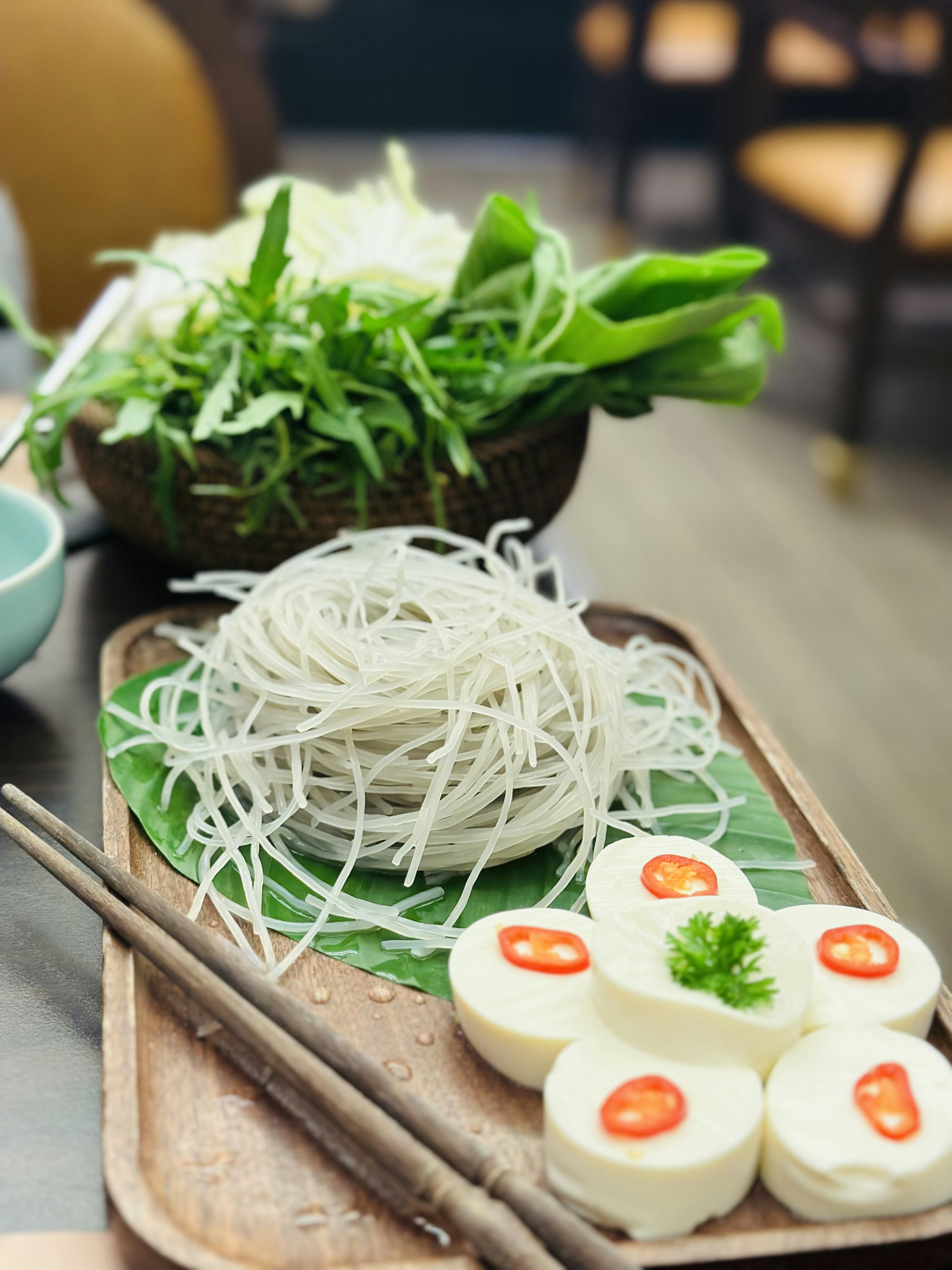 Banana-Leaf Vermicelli Nest: Herb Crown and Chili-Topped Egg Rounds