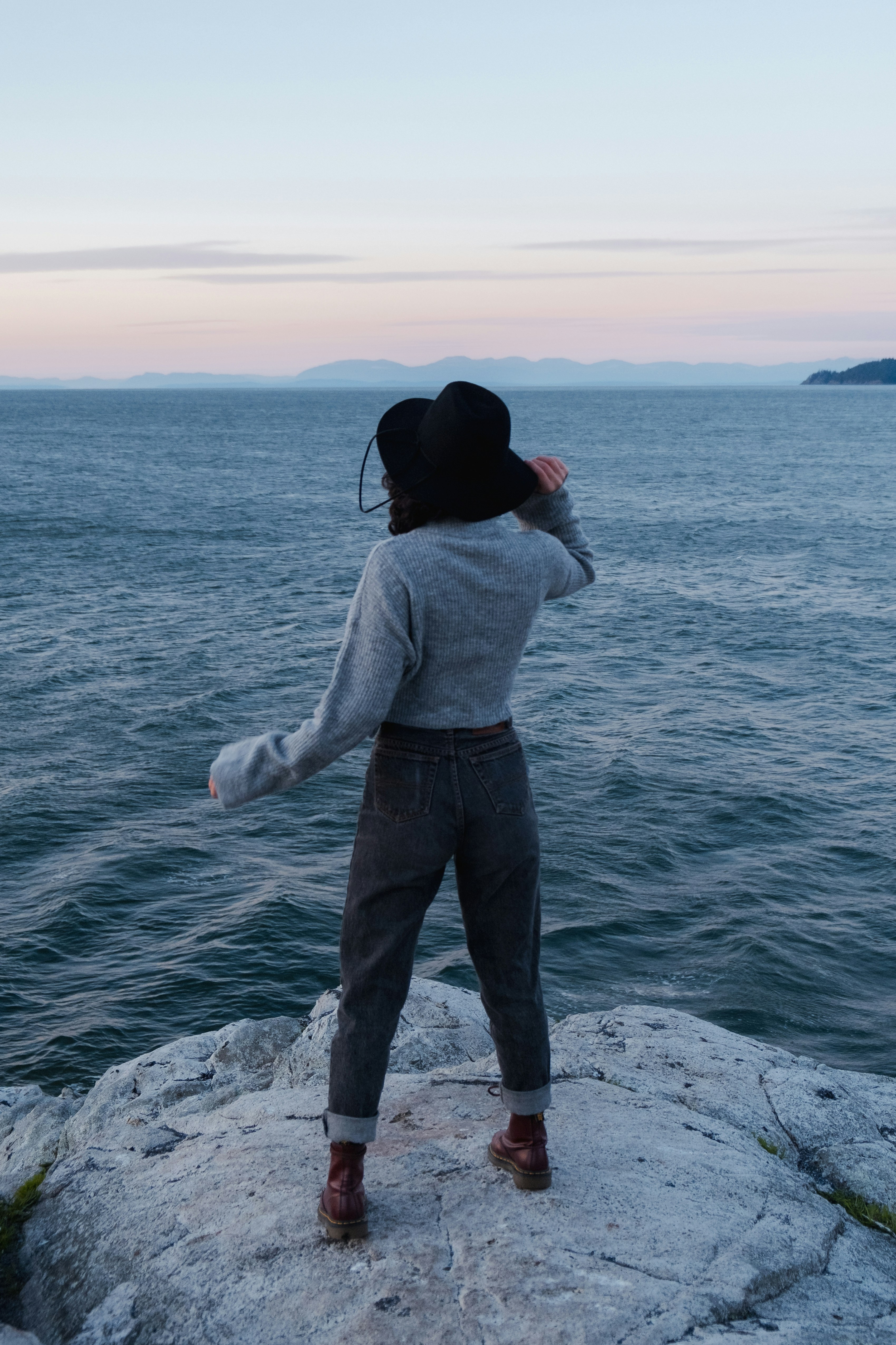 On the Edge of Quiet: A Figure at Sea's Horizon