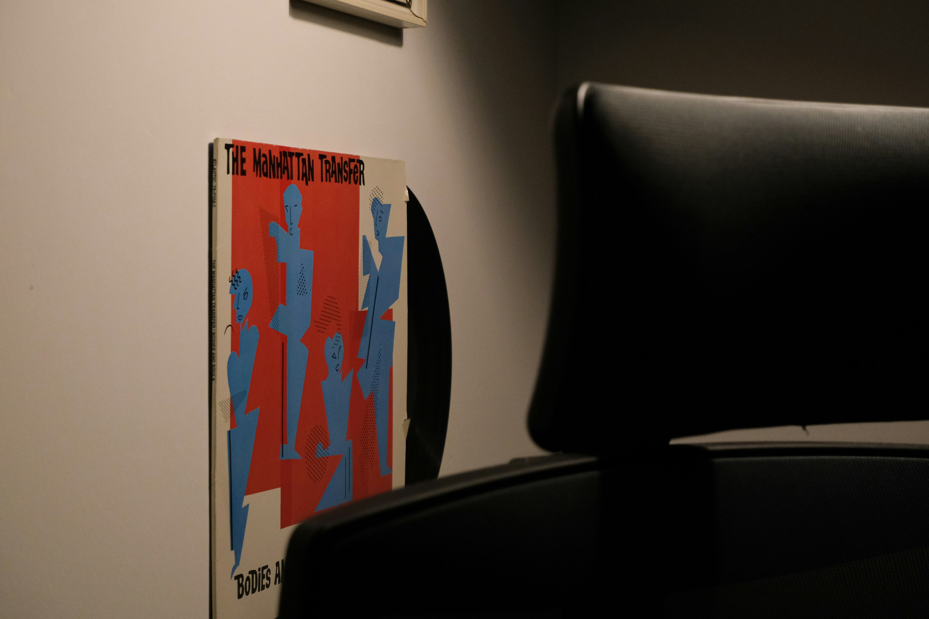 a chair and a clock on a wall