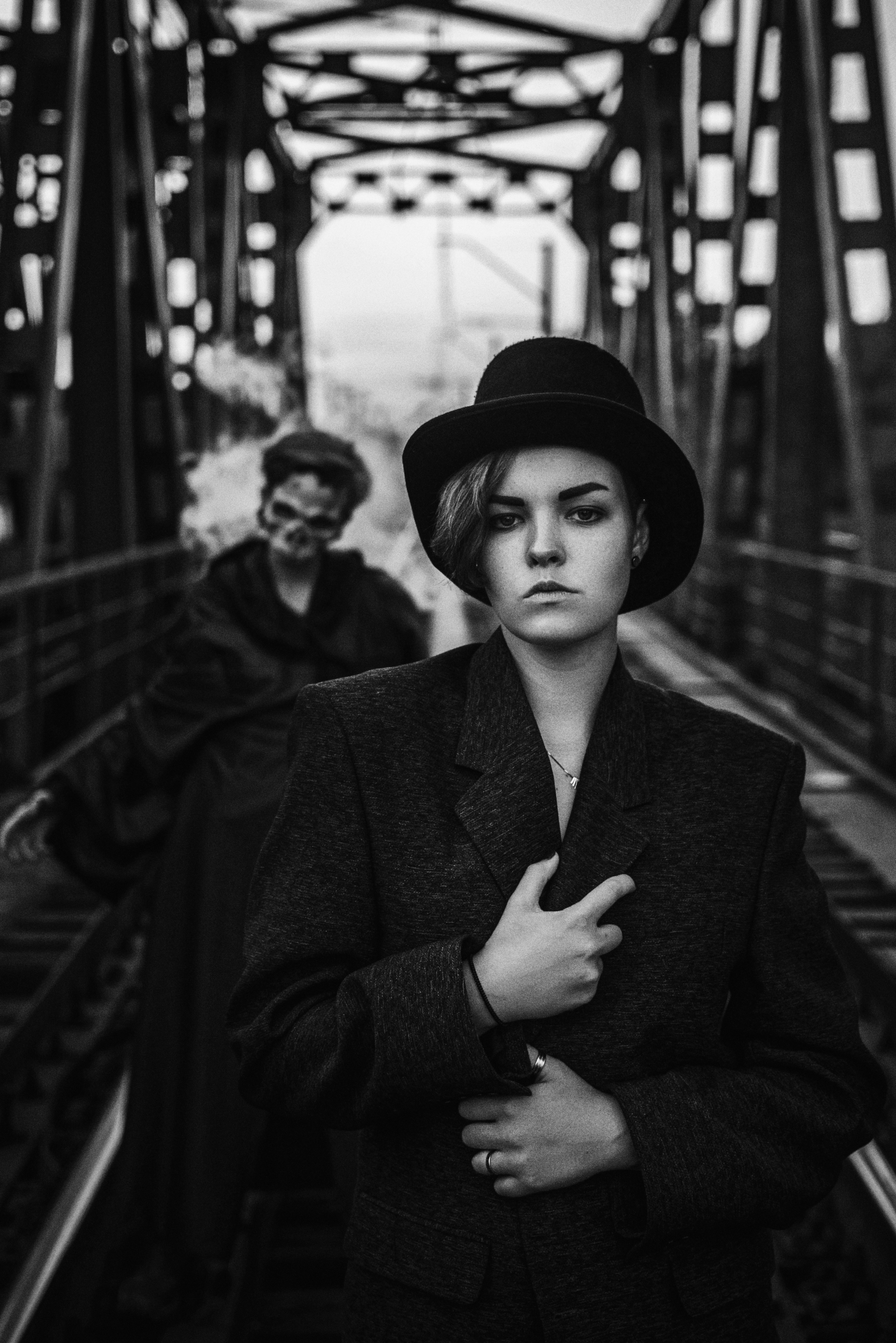 Gaze Between Iron Arches: A Quiet Portrait on the Bridge