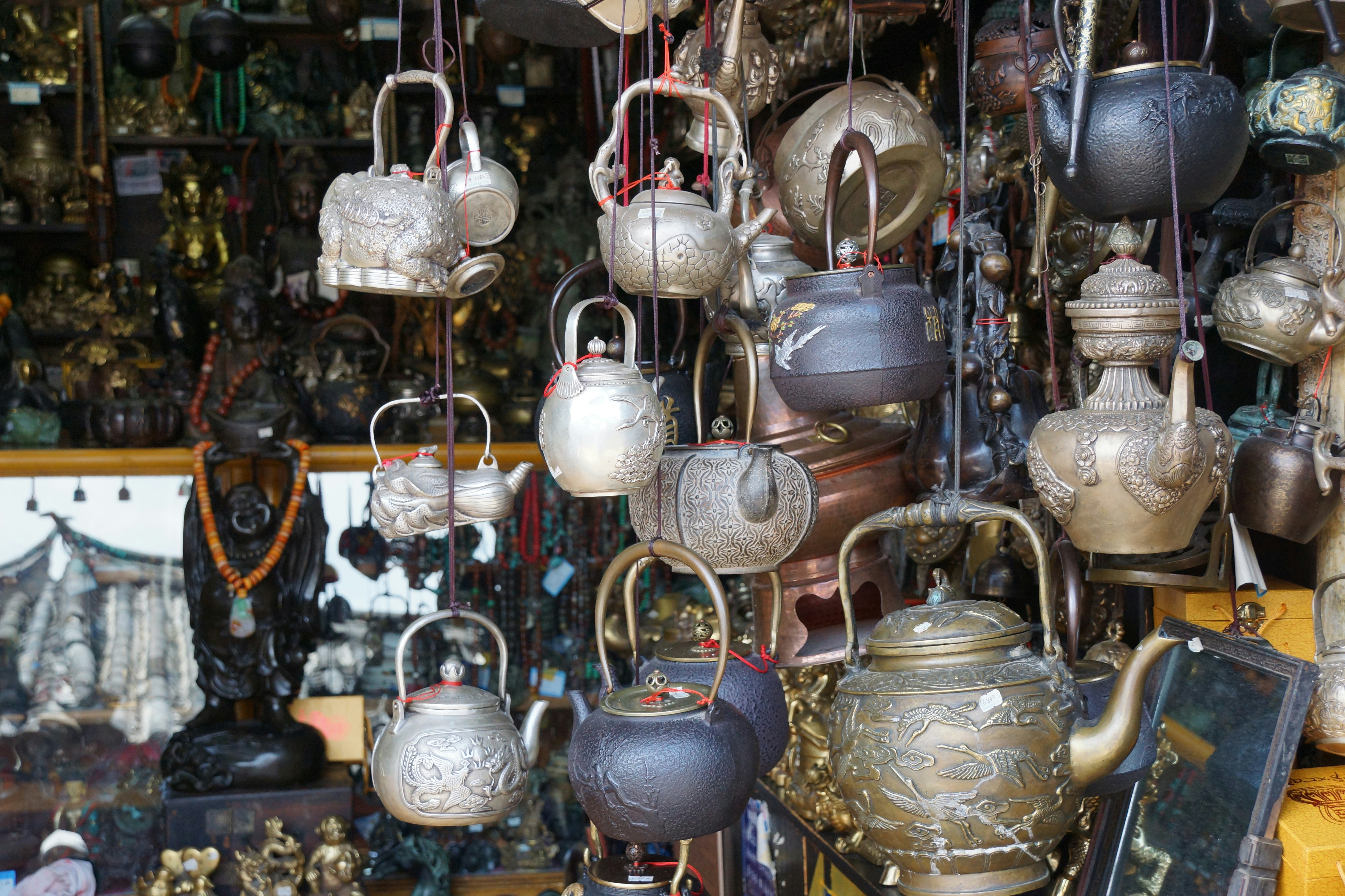 A display of teapots and other items in a store photo – Free China ...