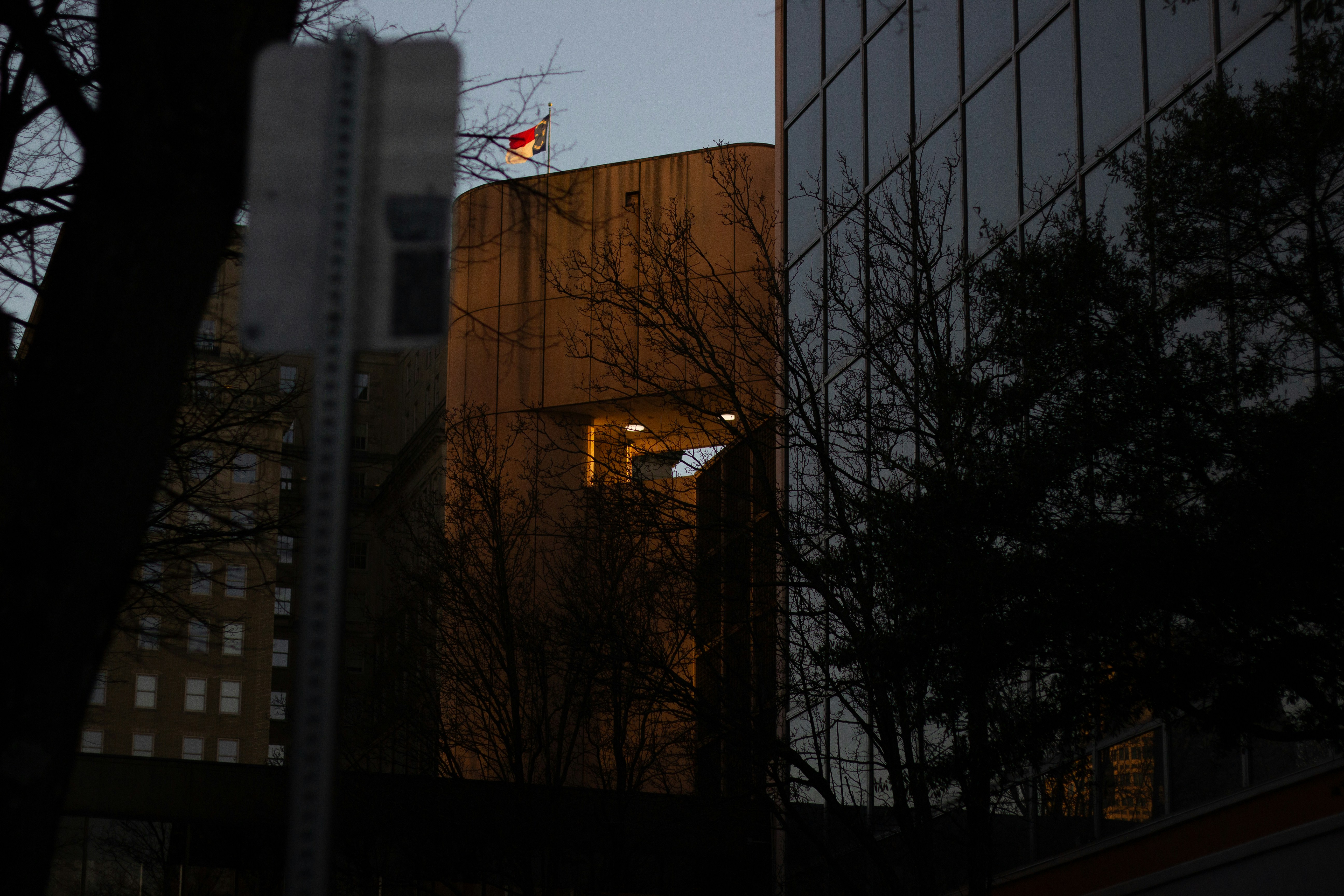 A tall building with a flag on top of it photo – Free Winston-salem ...