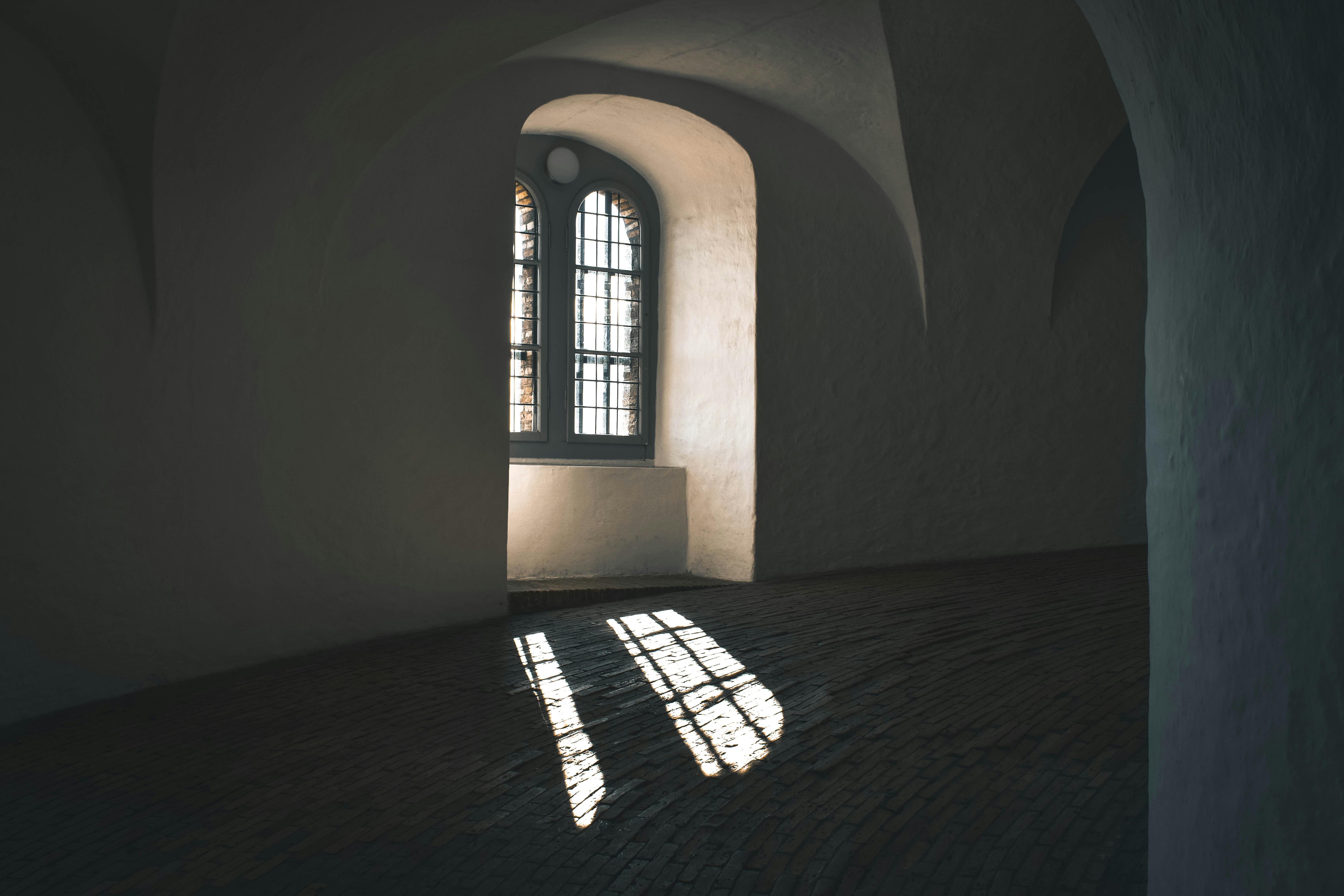 The sunlight is shining through the windows in the building photo ...