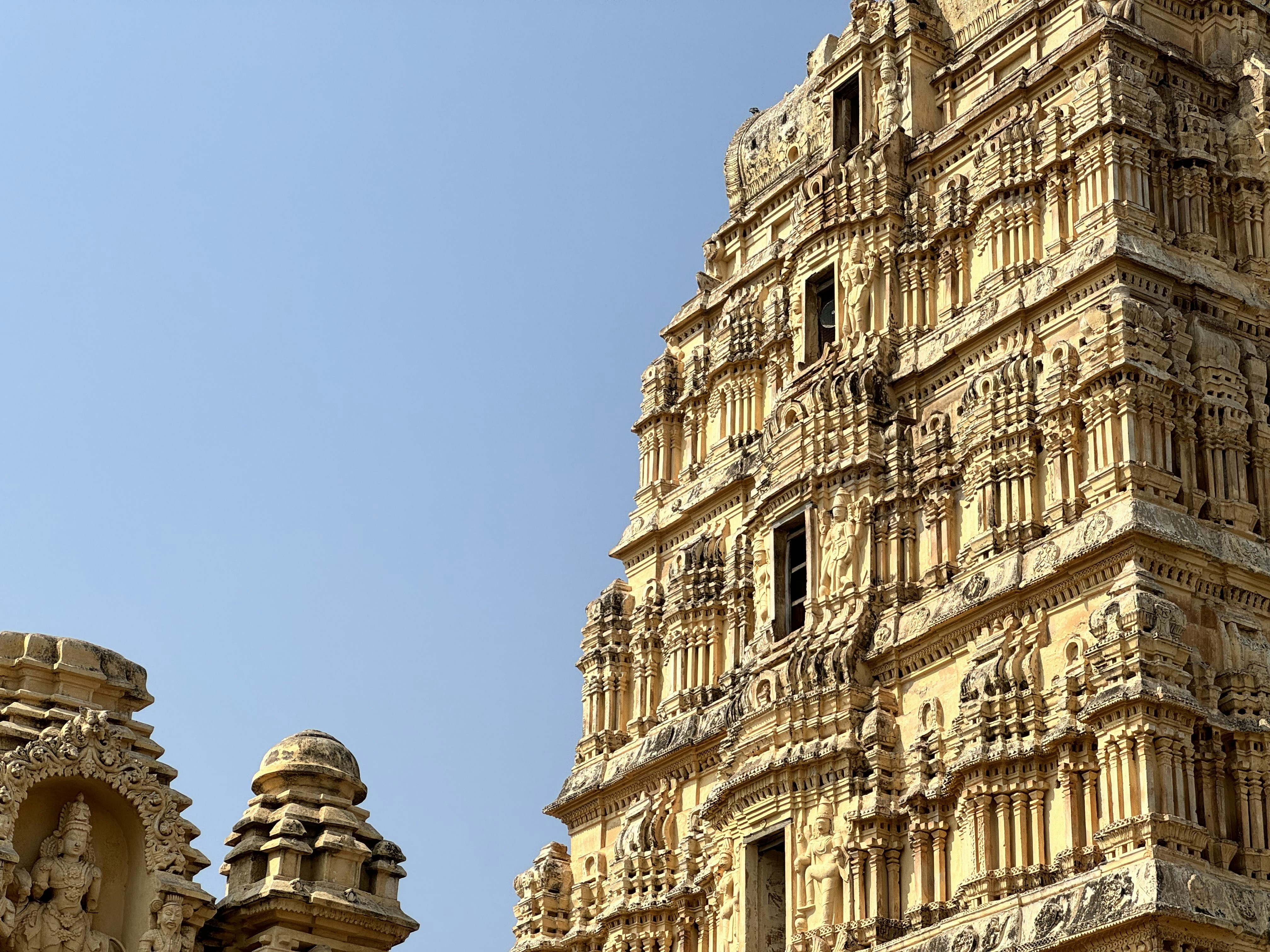 A tall tower with a clock on the top of it photo – Free Hampi Image on ...