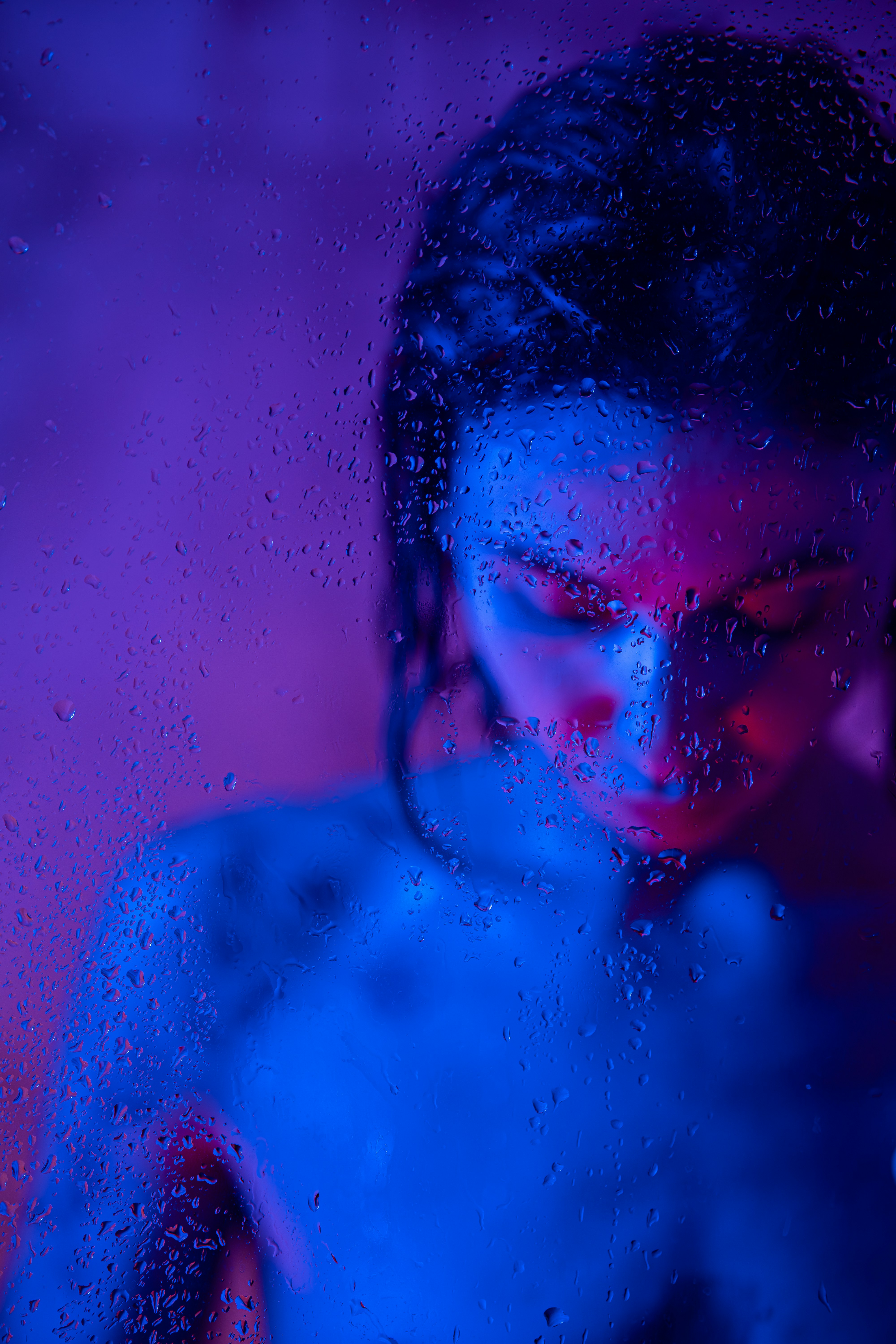 Neon Glass Portrait: Rain Through a Veil of Color