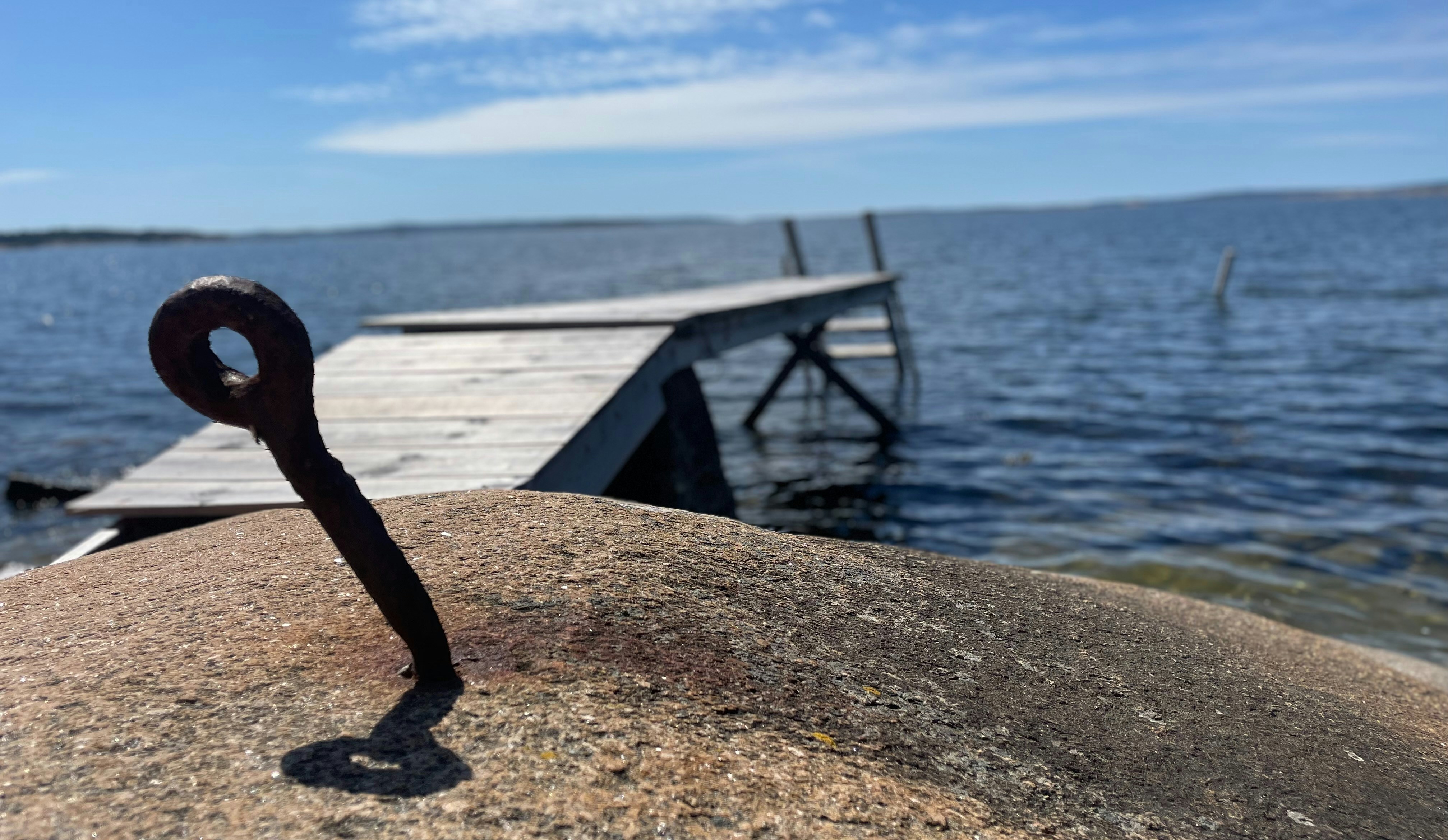 Rusty Anchor and Weathered Pier