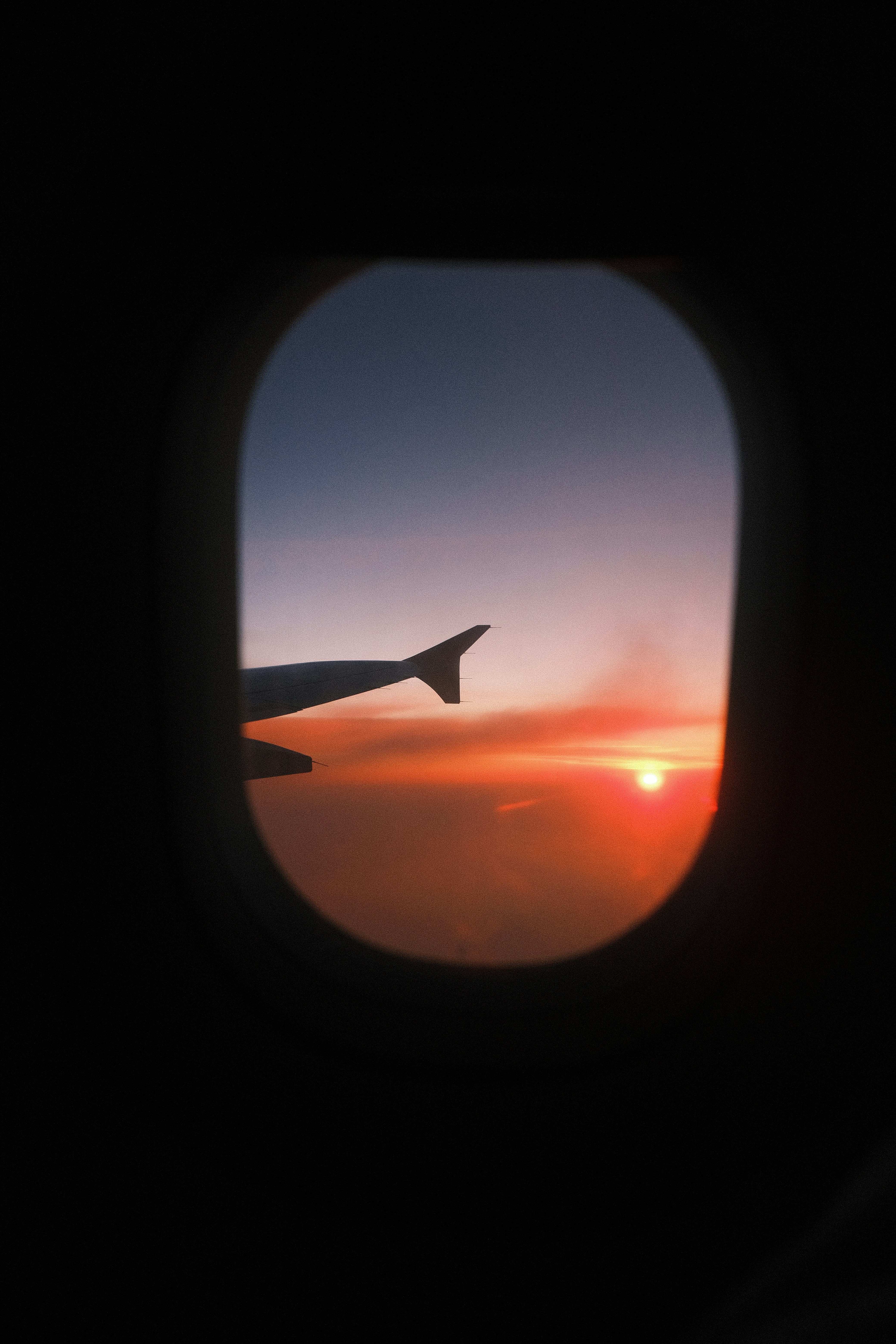 A view of a sunset through an airplane window photo – Free Window Image ...