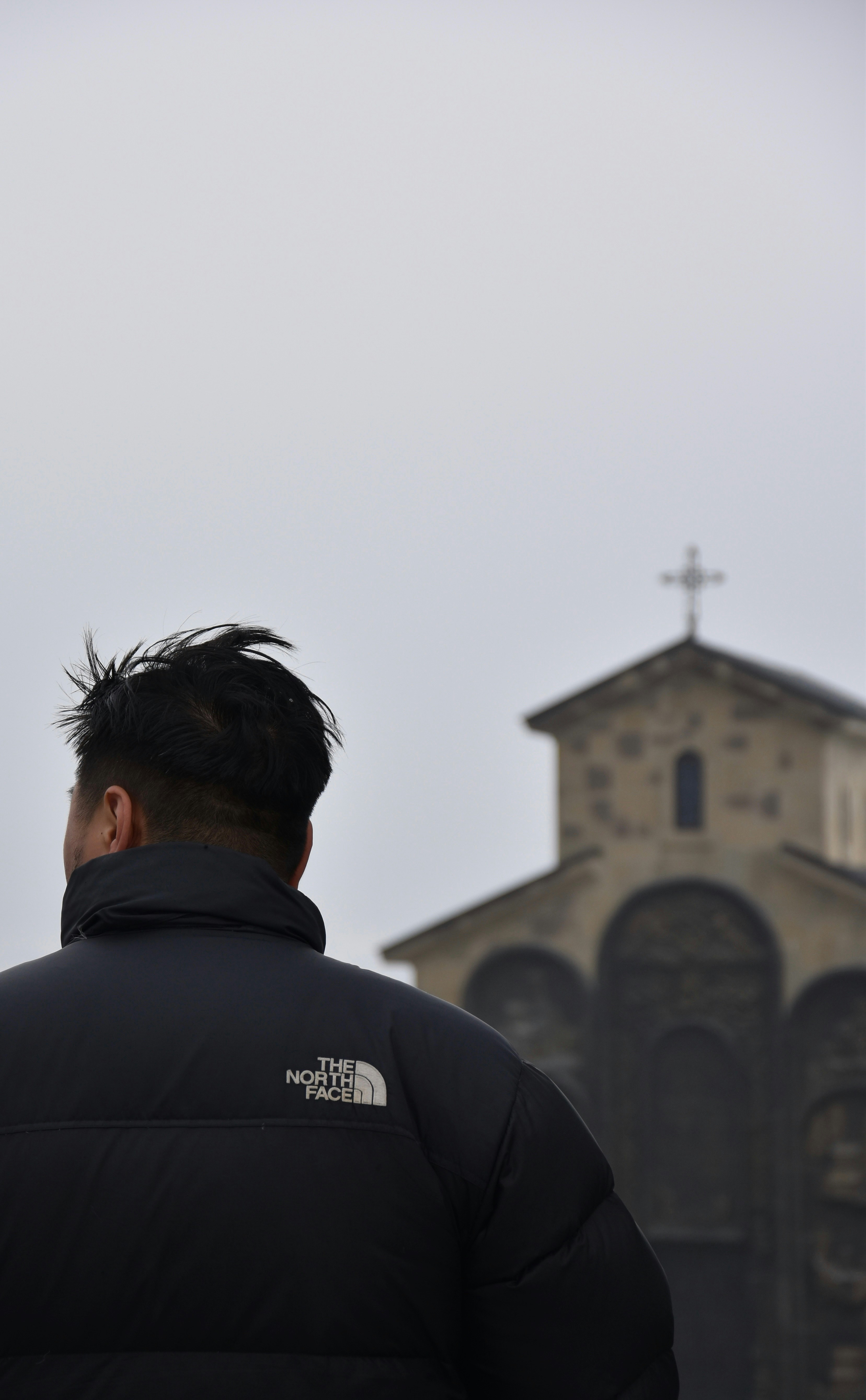 Back View at the Church: A Social Moment in the Cold