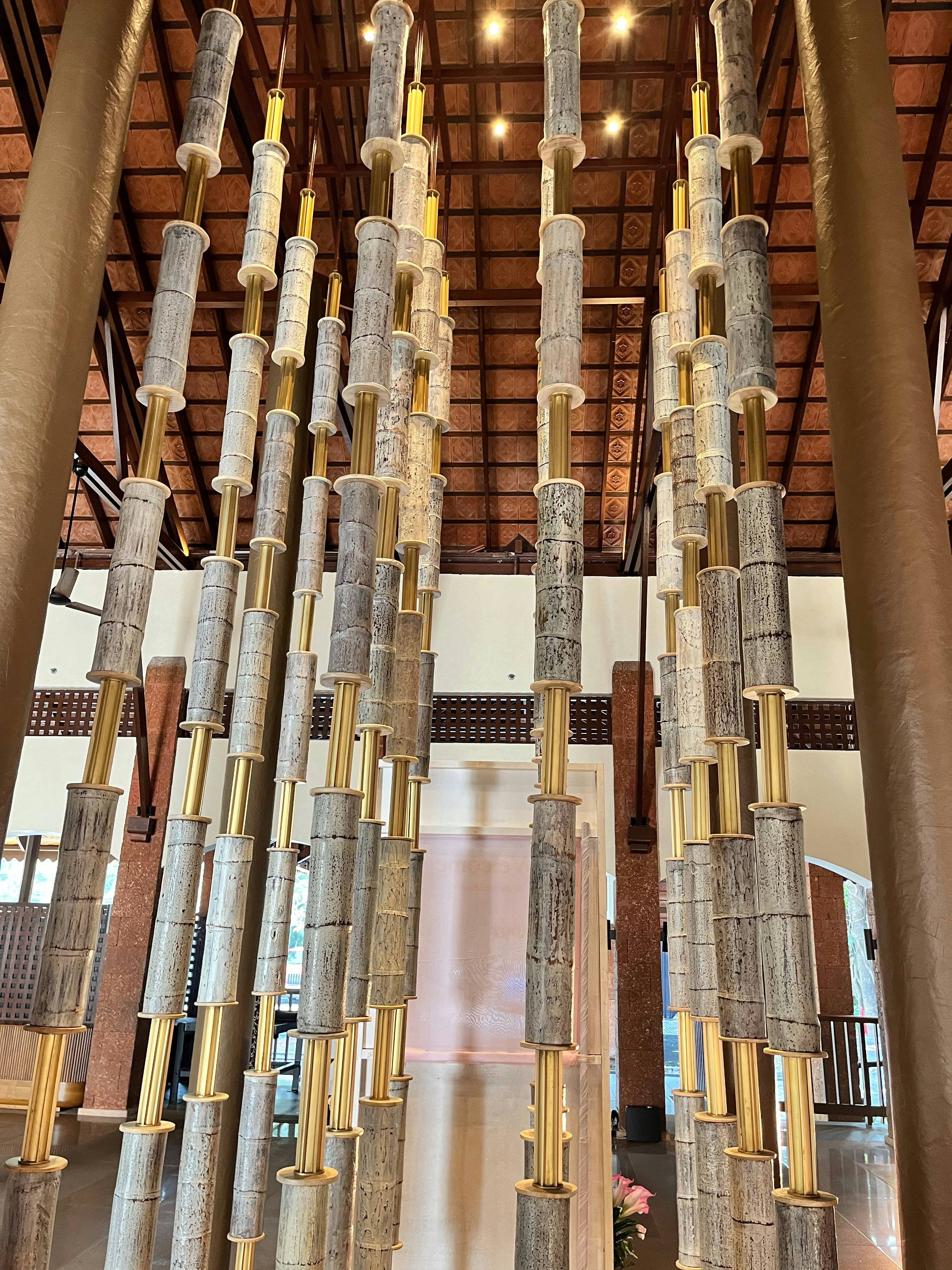 A very tall building with a bunch of columns inside of it photo – Free ...