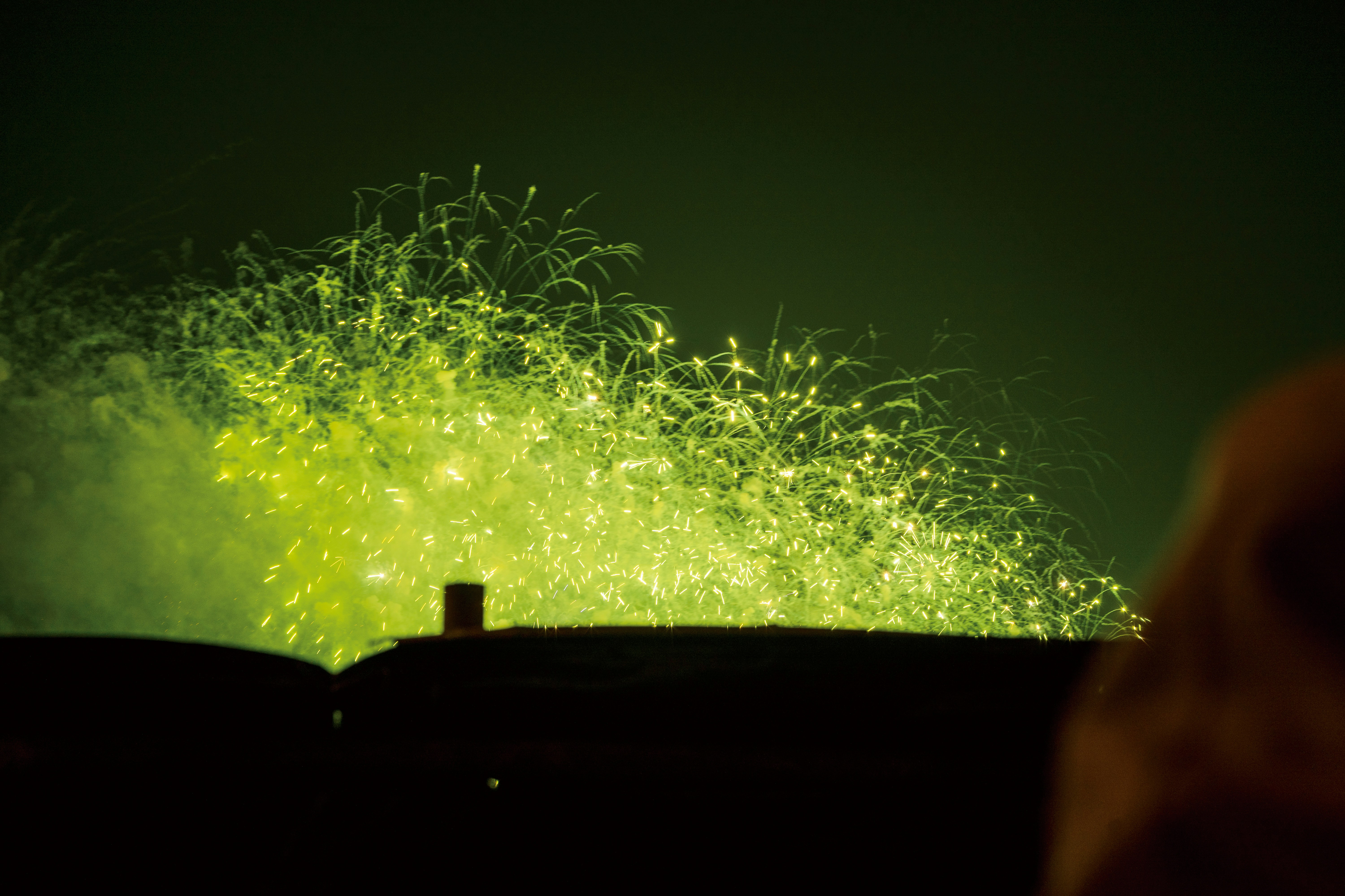 A green fireworks is lit up in the night sky photo – Free Fireworks ...