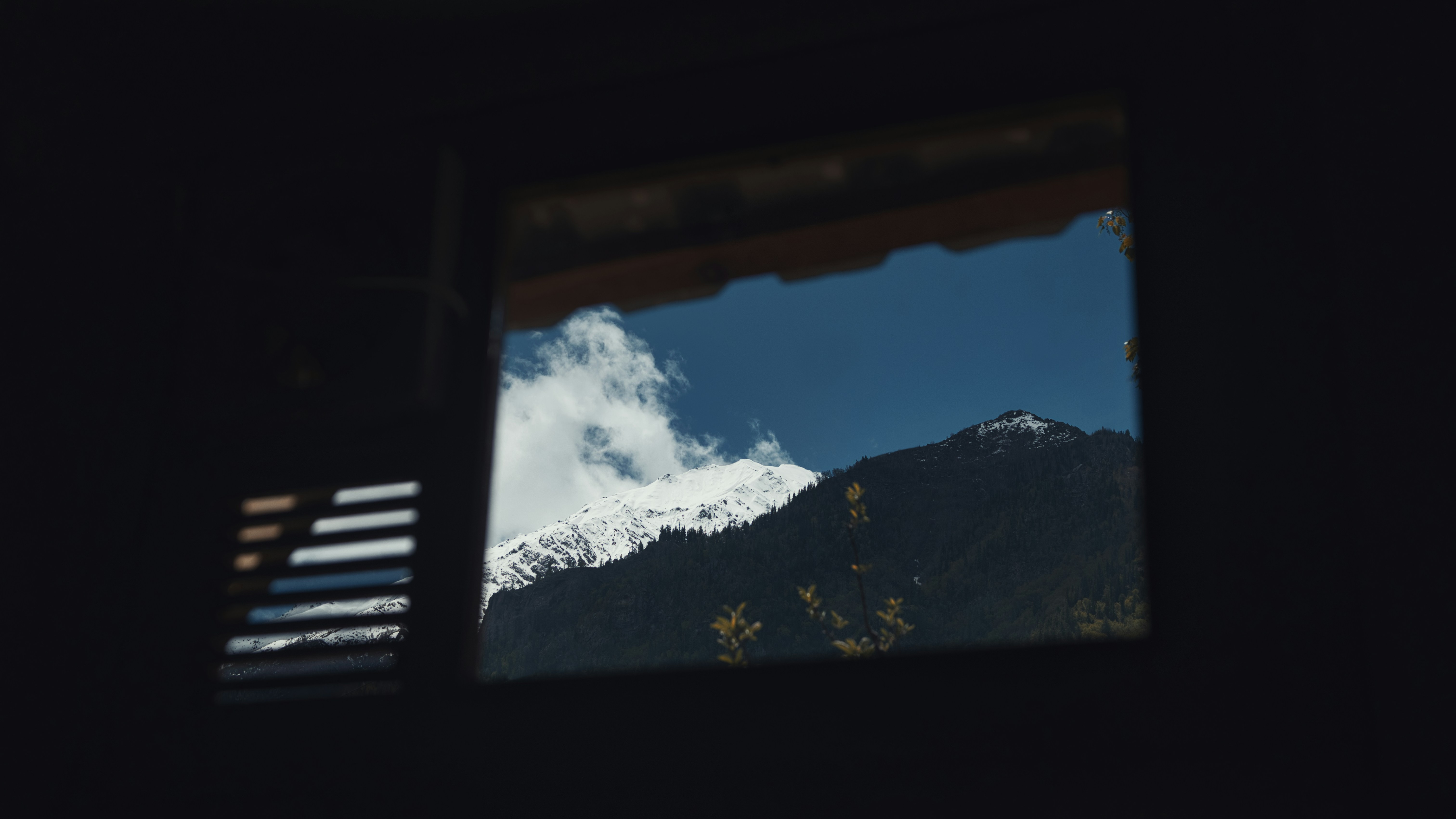 A view of a mountain through a window photo – Free Spiti Image on Unsplash