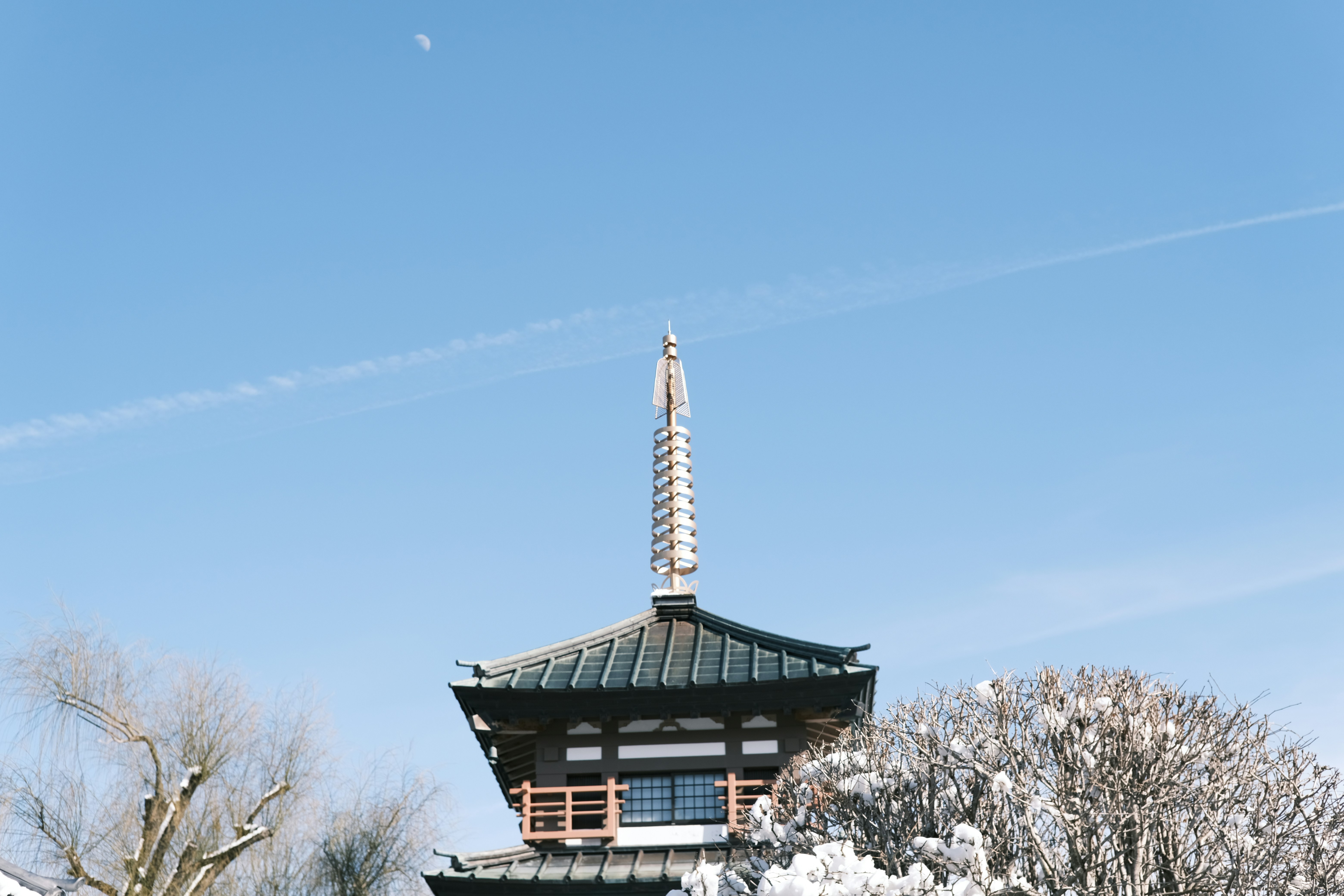 Spire Over Blue: A Pagoda Reaches Toward Spring Skies