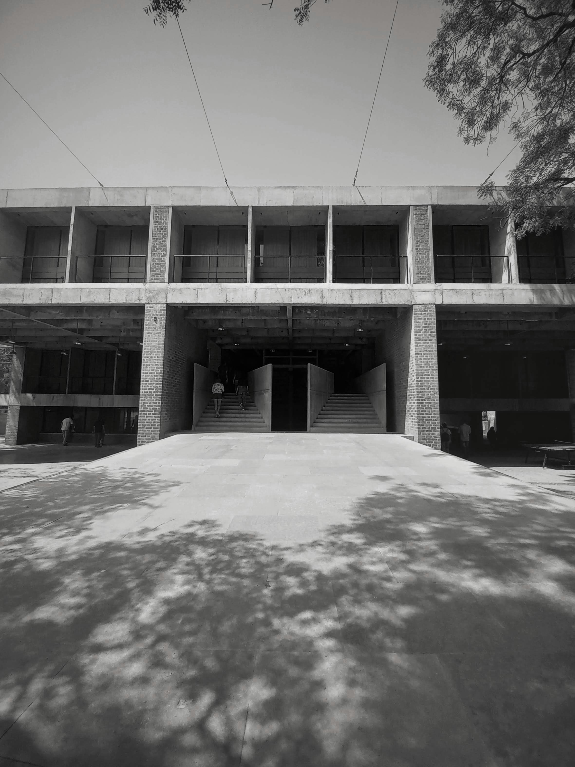 Symmetry at the Steps: A Monumental Facade of Concrete and Light