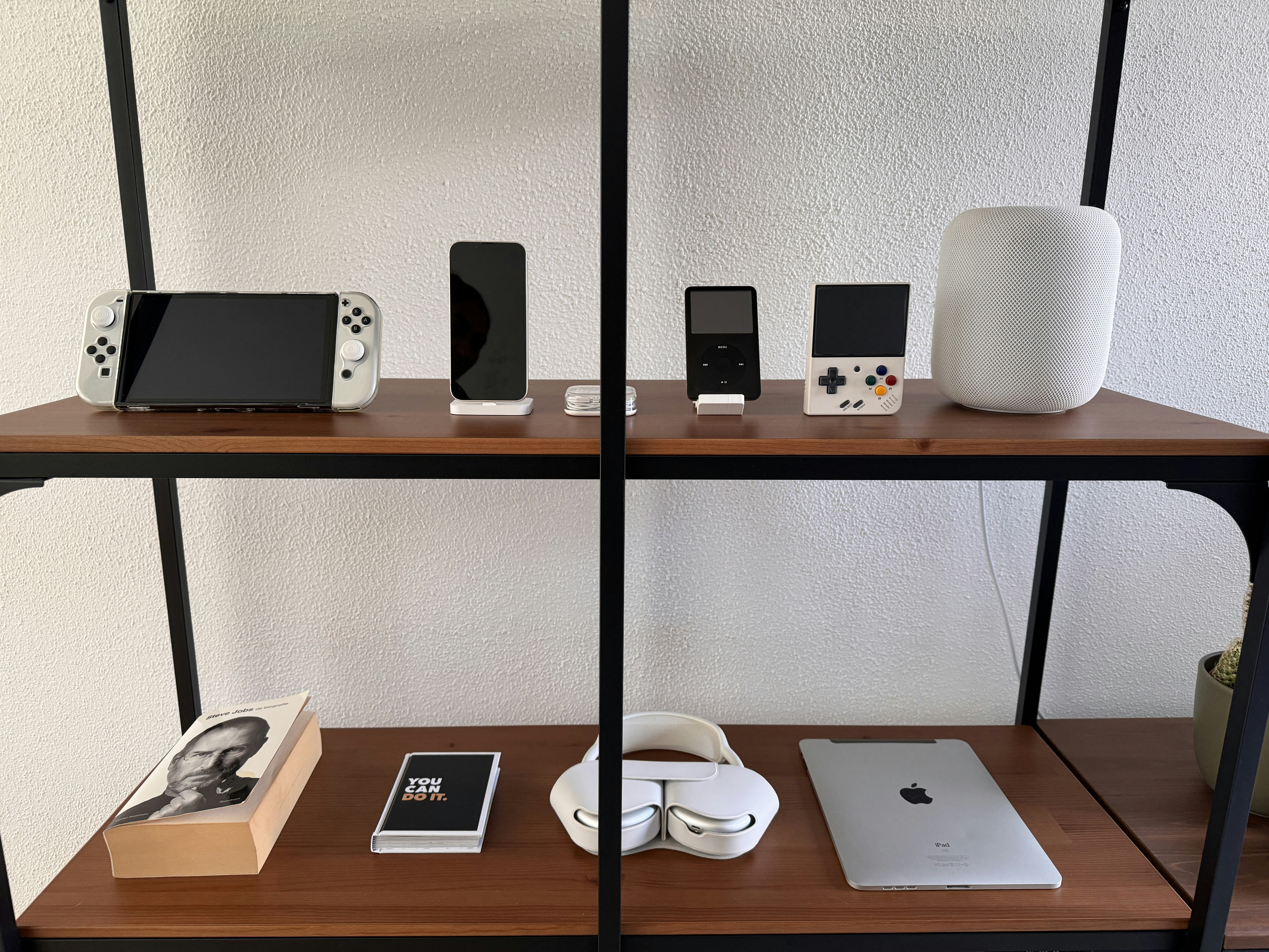 A shelf with a bunch of electronic devices on it photo – Free Ipod ...