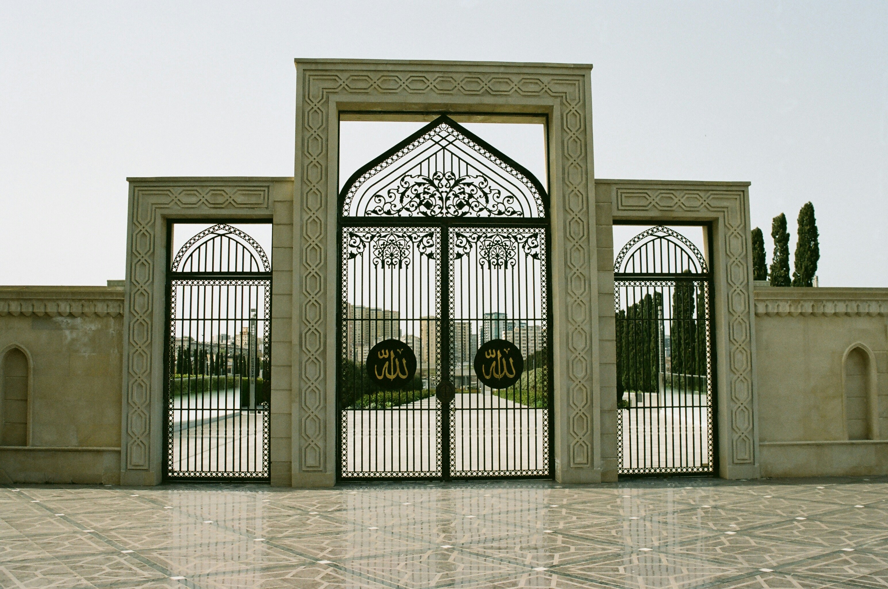 The Gate of Echoing Arches: Iron Symmetry Framing a Garden View