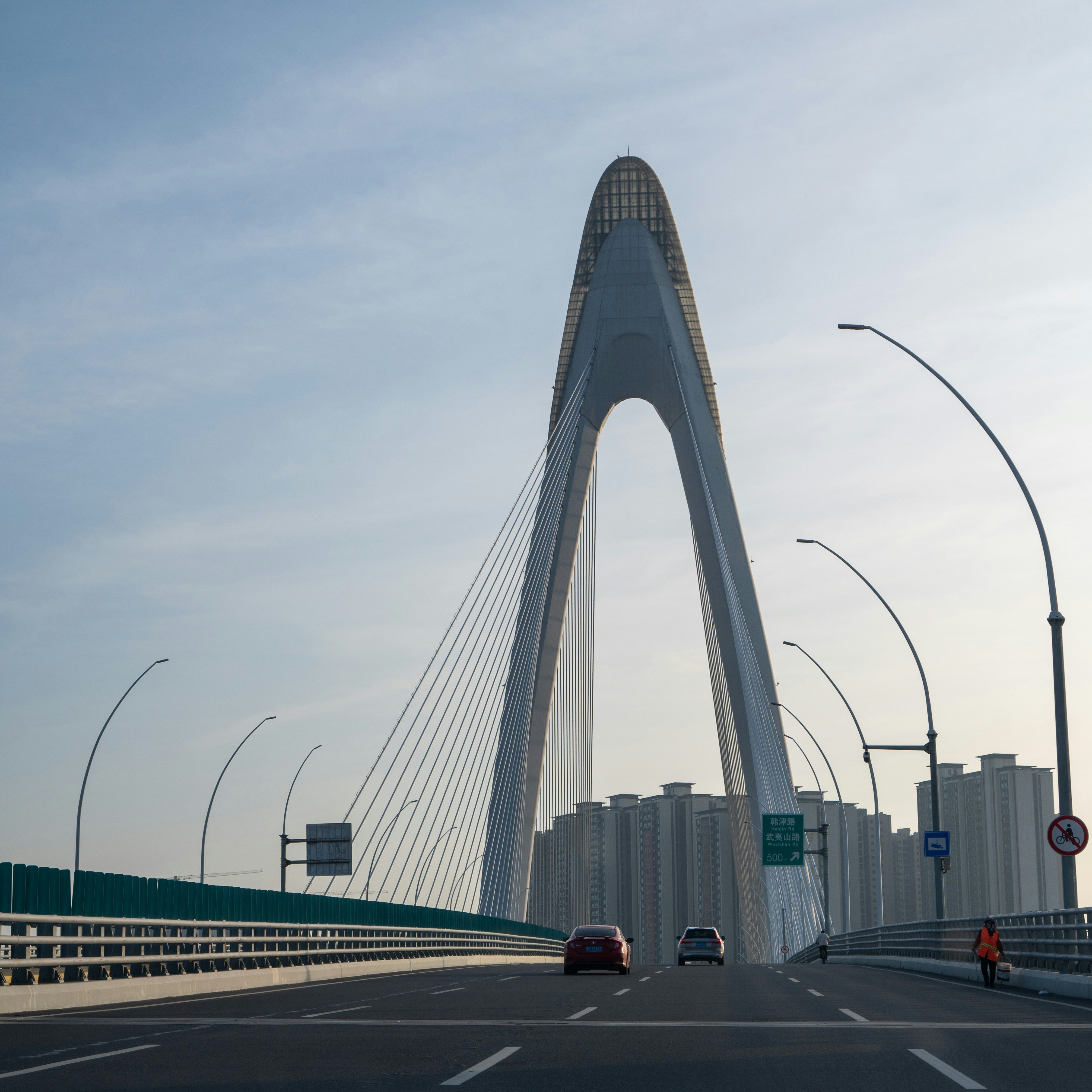 A very tall bridge spanning over a city photo – Free China Image on ...