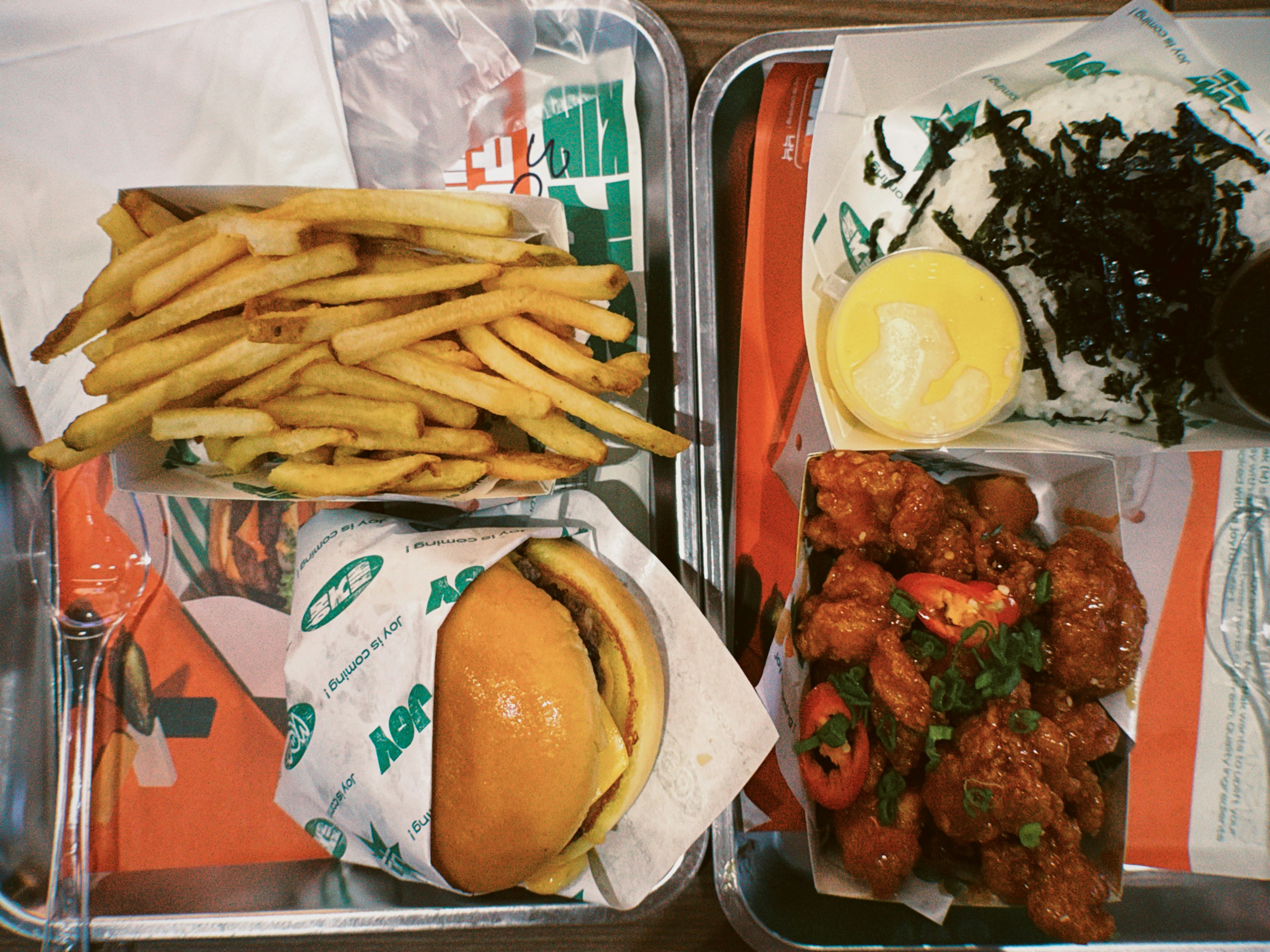 Tray of Golden Comfort: Fries, Burger, and Glazed Chicken Bites