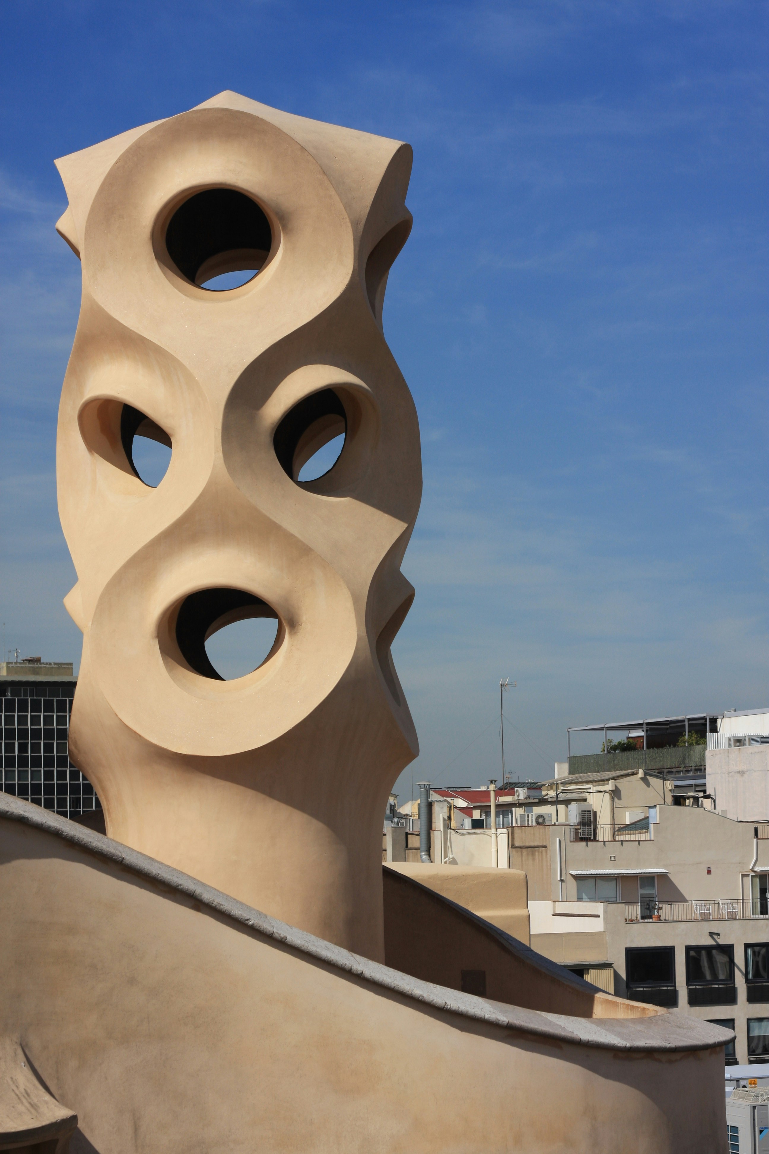 a sculpture of a face with holes in it