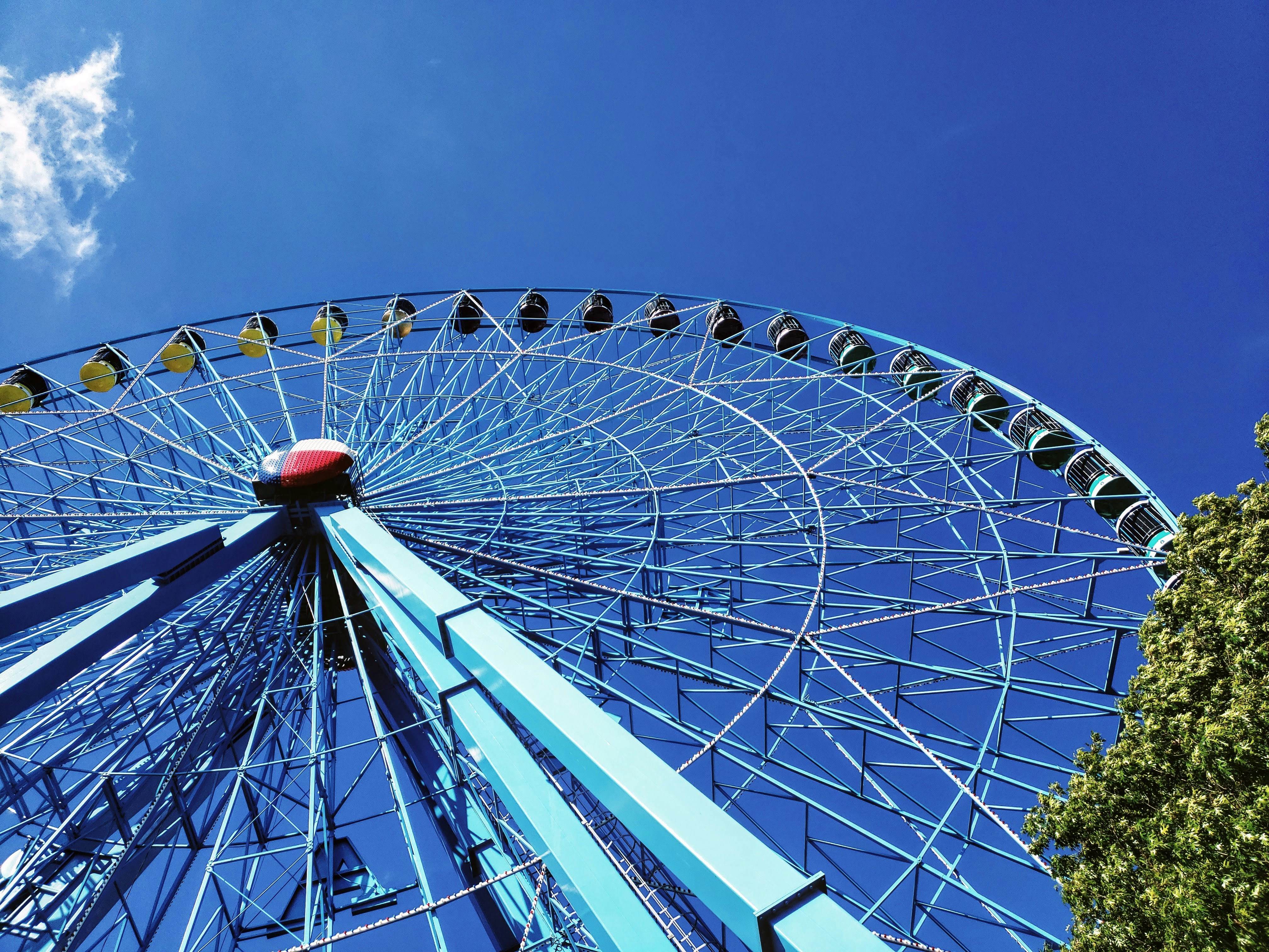 Cobalt Sky, Red Hub: The Ferris Wheel's Geometric Rhythm