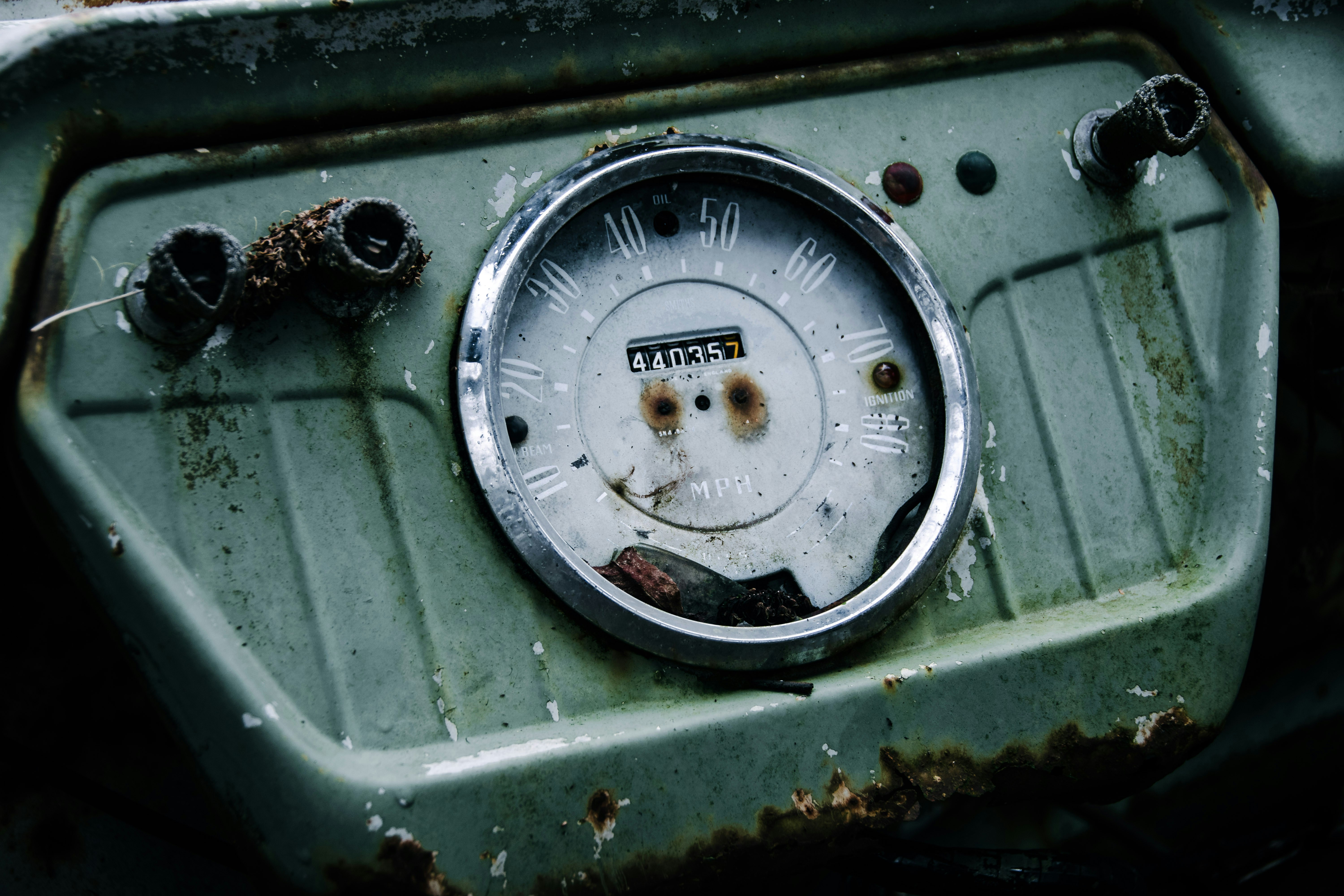 Verdigris Speedometer: A Quiet Relic of a Worn Motorcycle