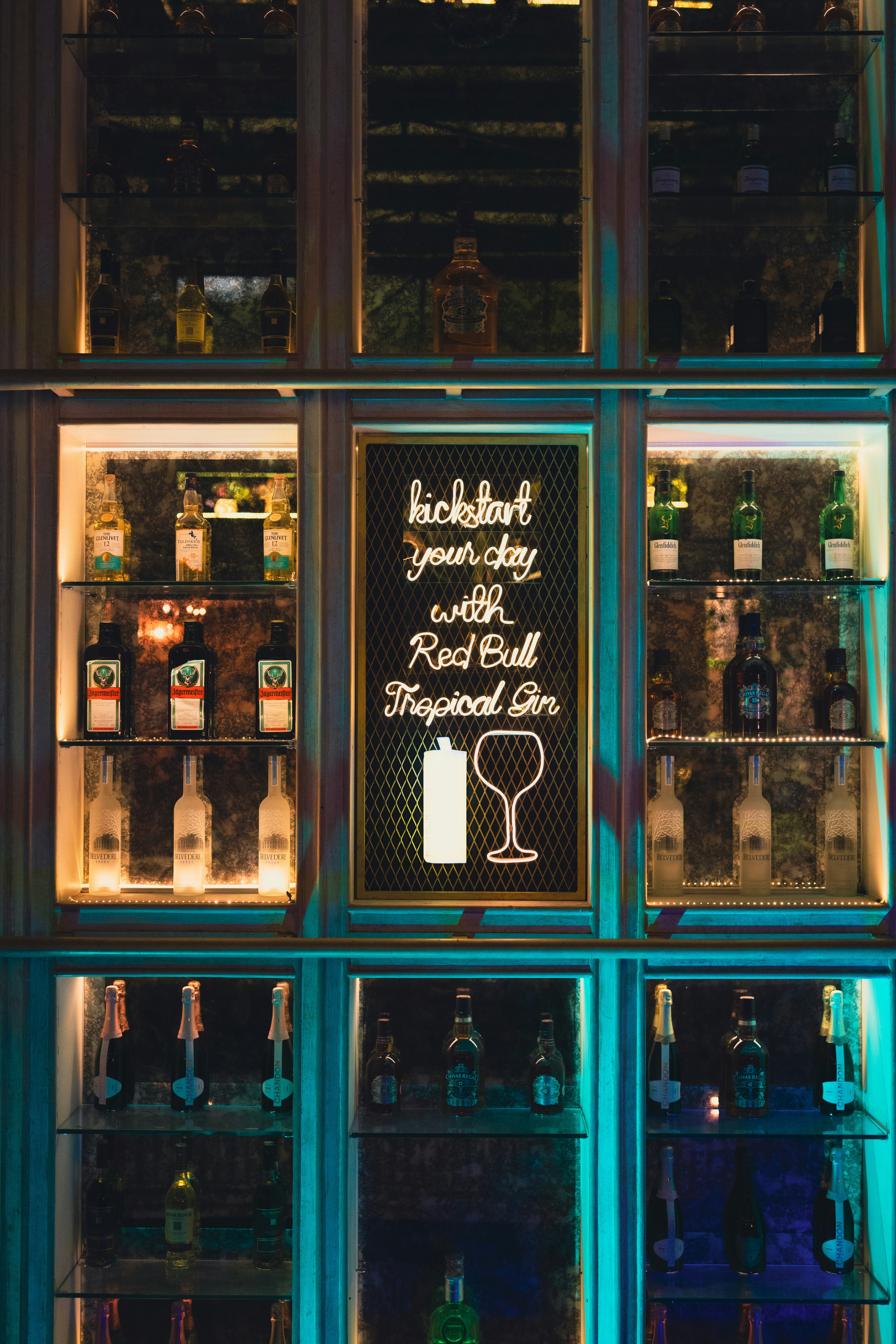 A display of liquor bottles in a window photo – Free Pub Image on Unsplash